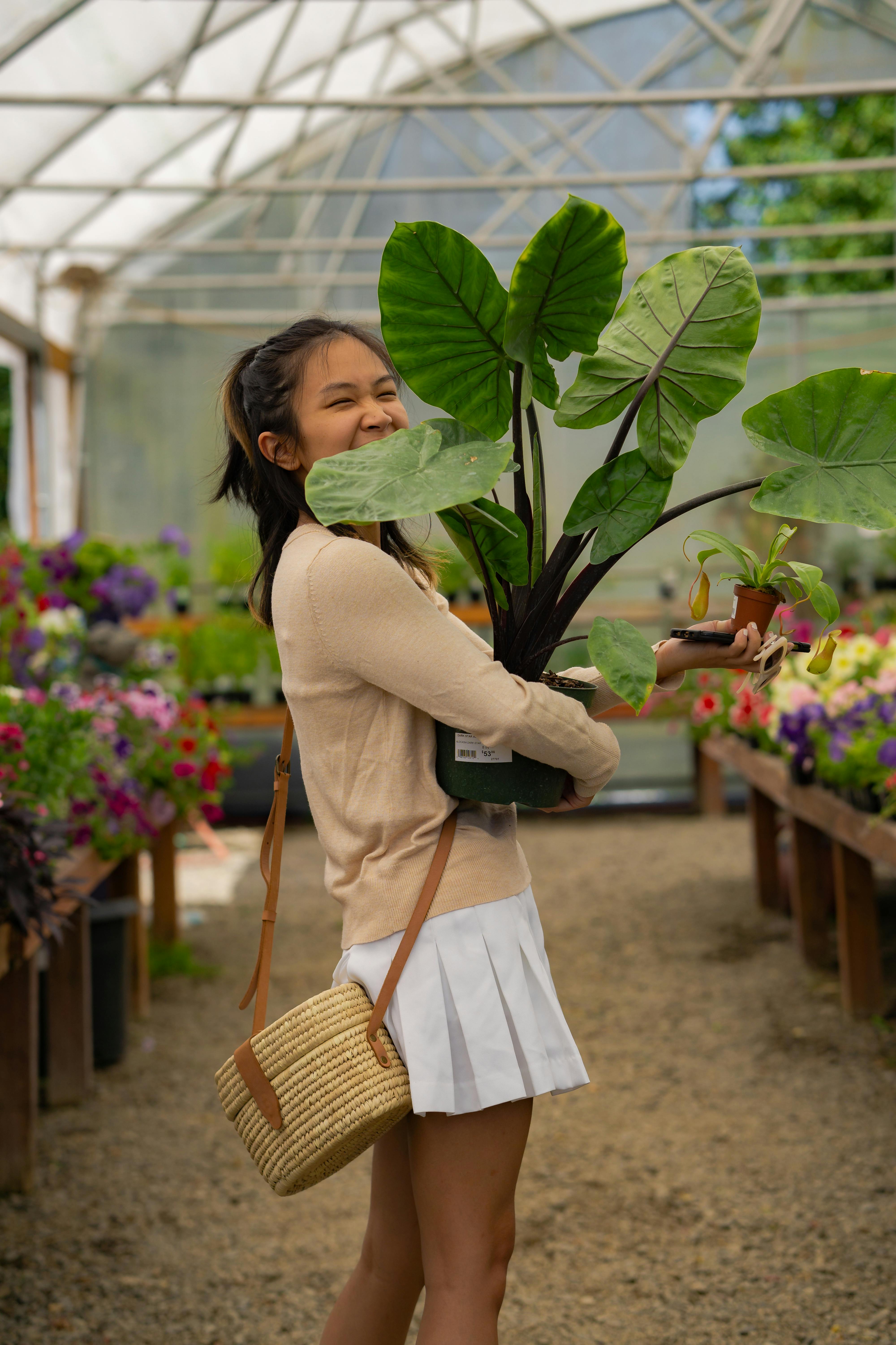 Graceful young ethnic lady relaxing in botanical garden · Free Stock Photo
