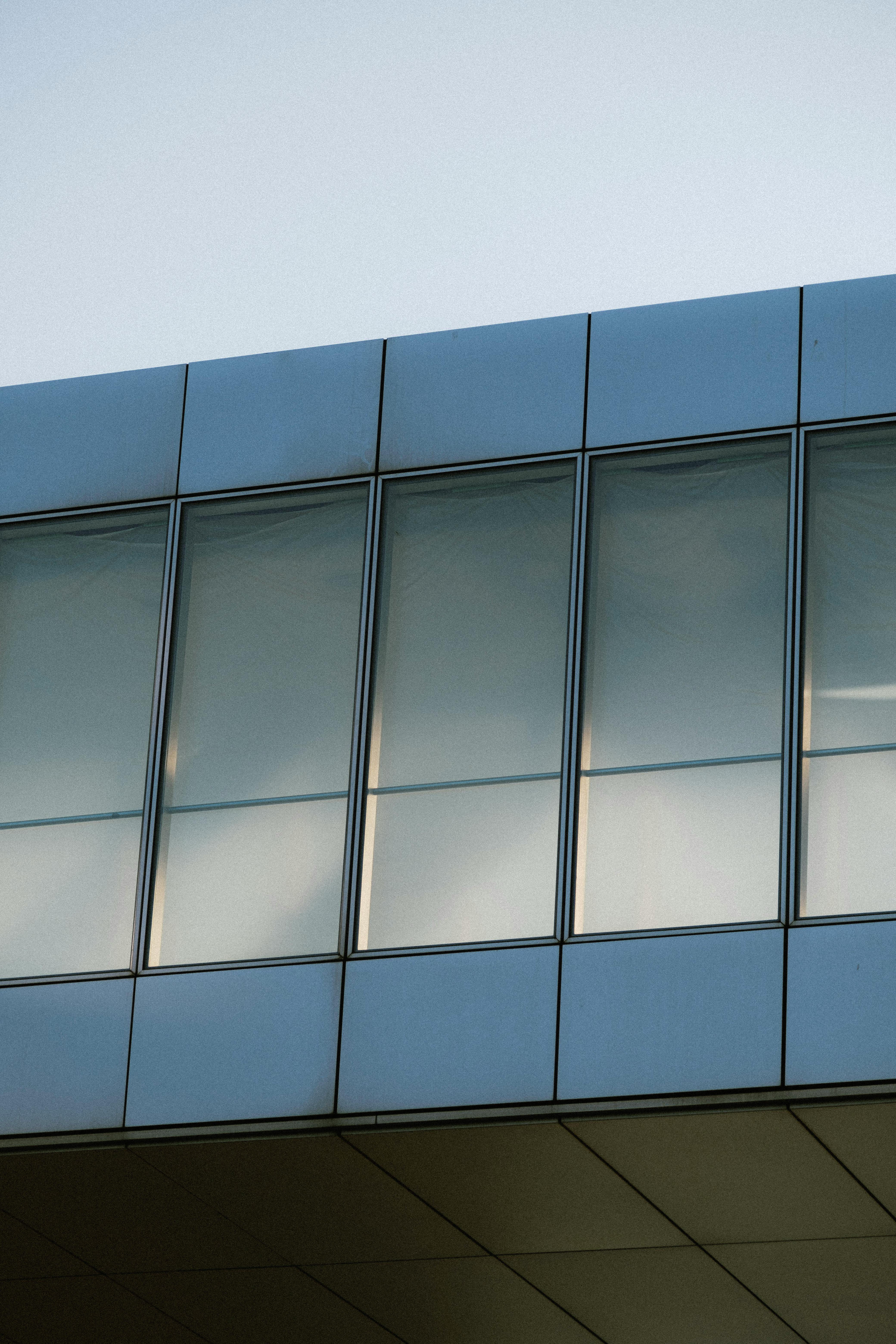 Gray Concrete Building with Glass Windows · Free Stock Photo