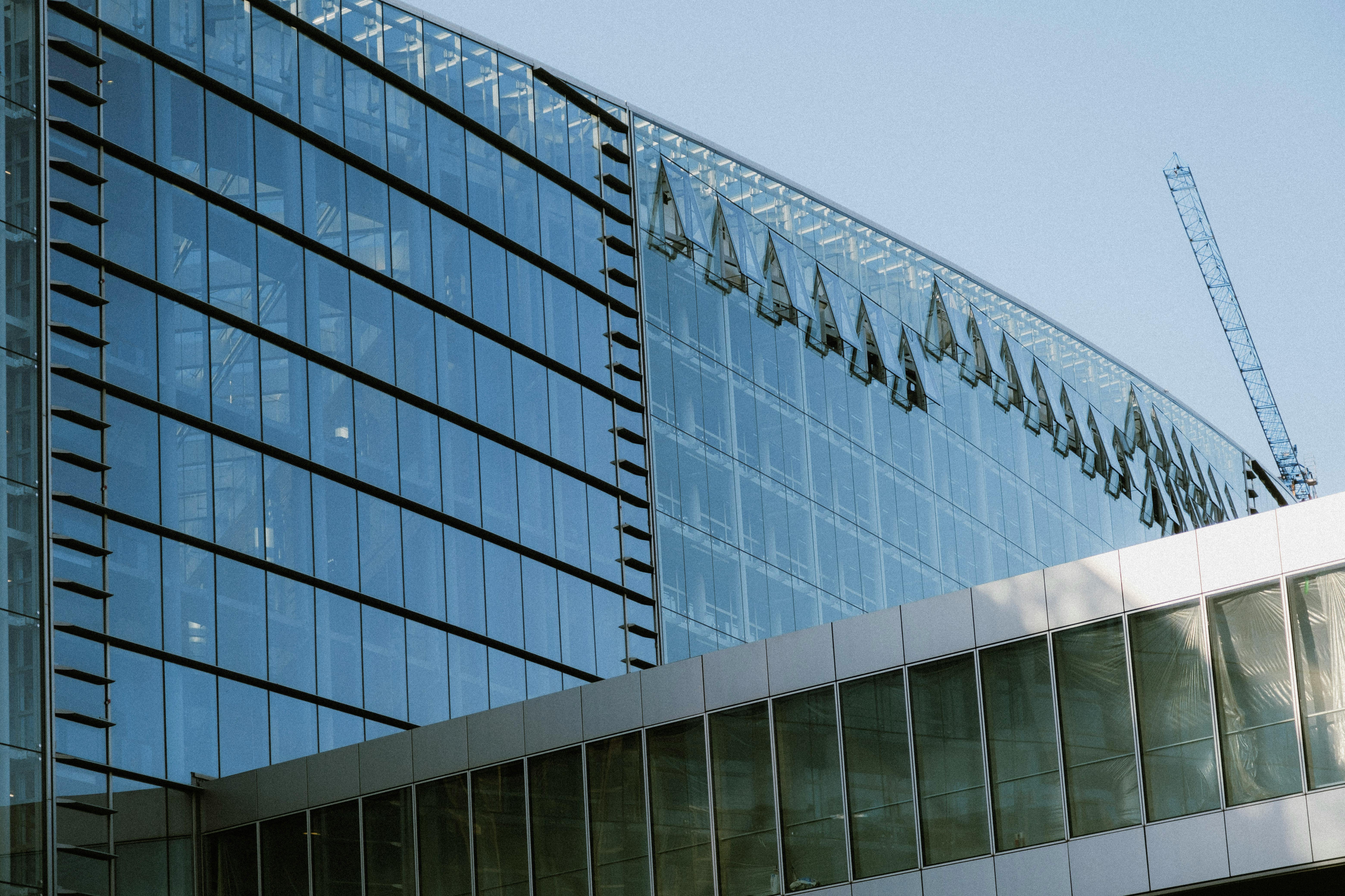 High-Rise Building with Glass Wall · Free Stock Photo