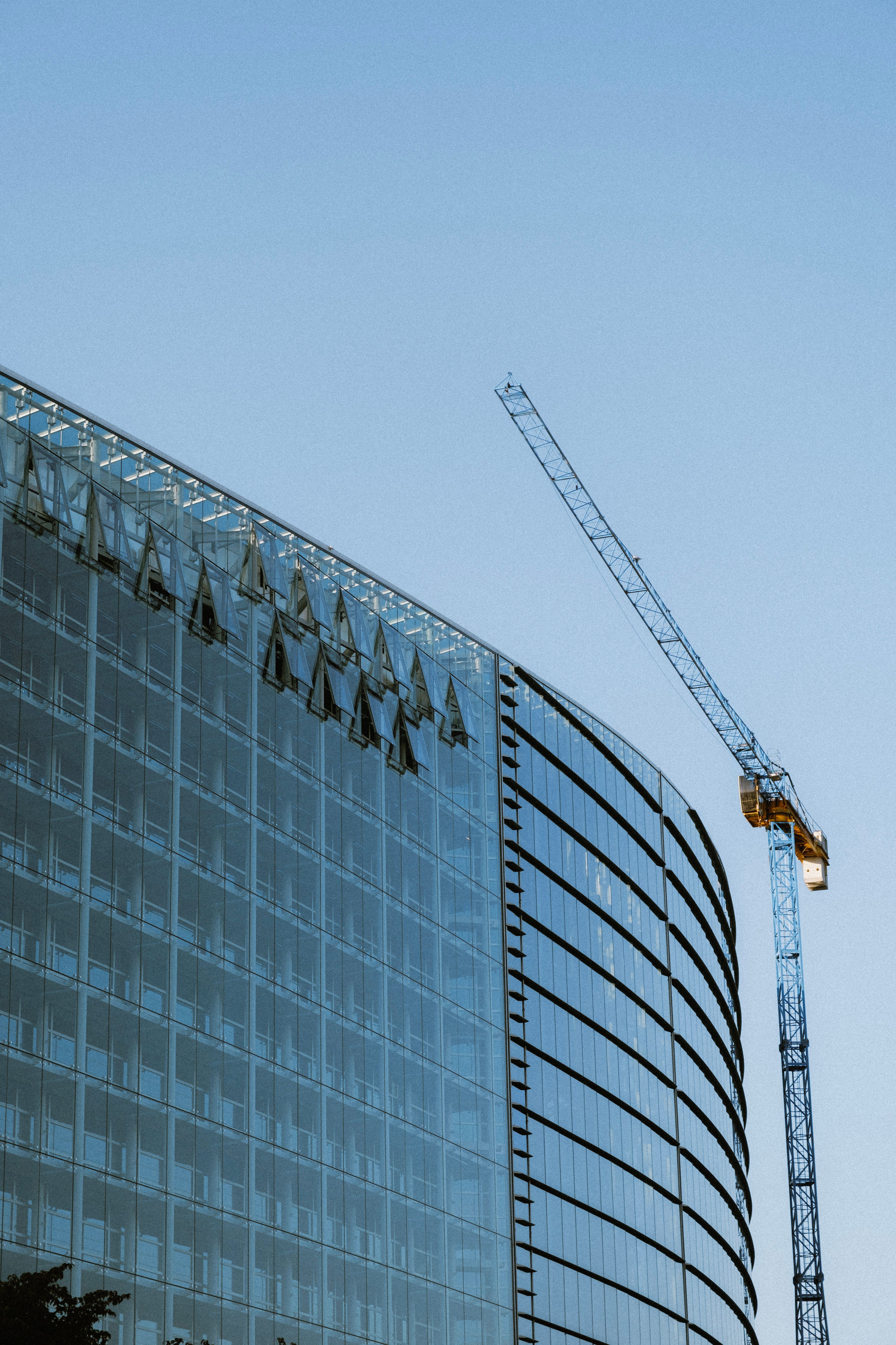 Blue Tower Crane Under the Blue Sky · Free Stock Photo