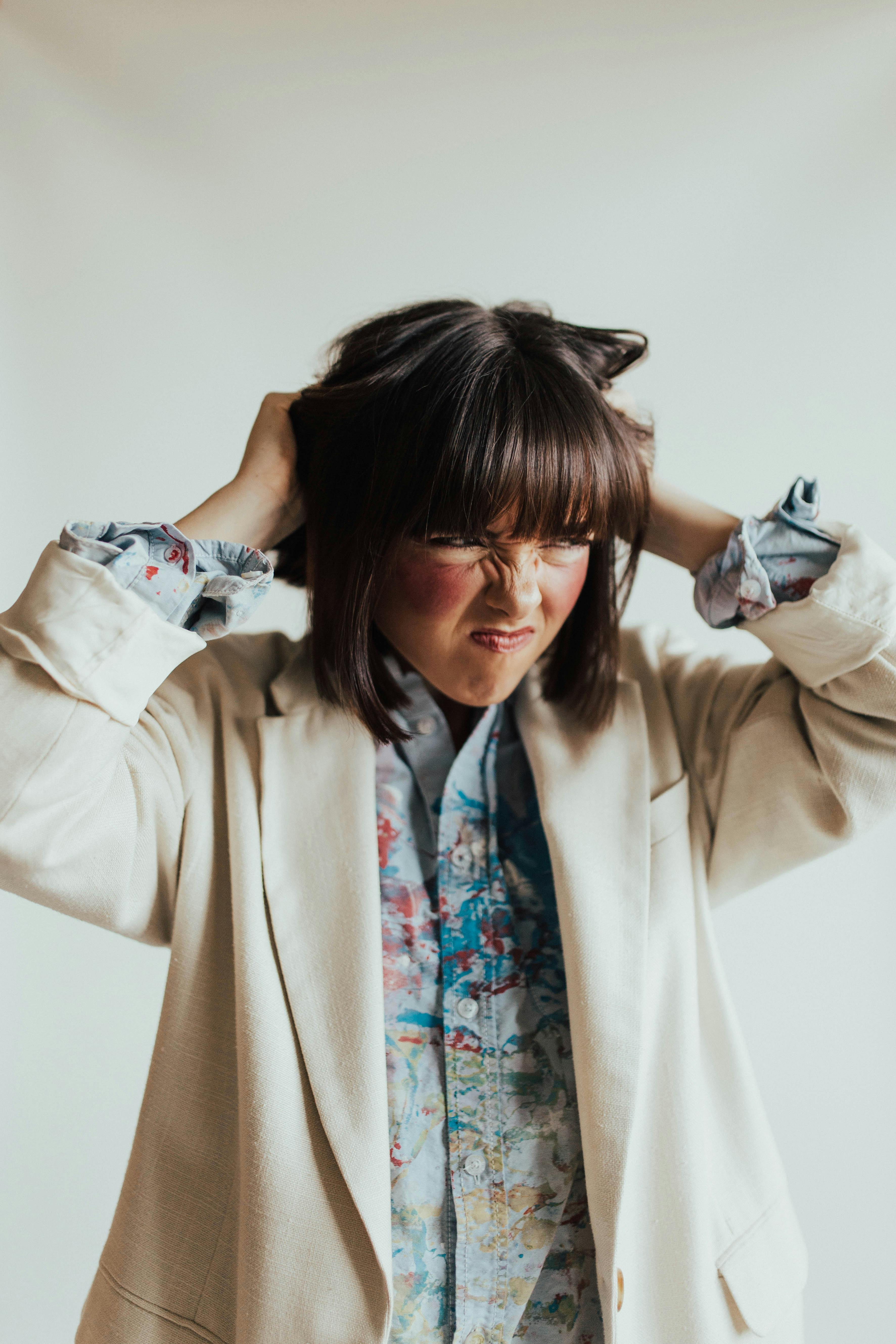 Angry Woman Holding Her Hair Short Hair · Free Stock Photo