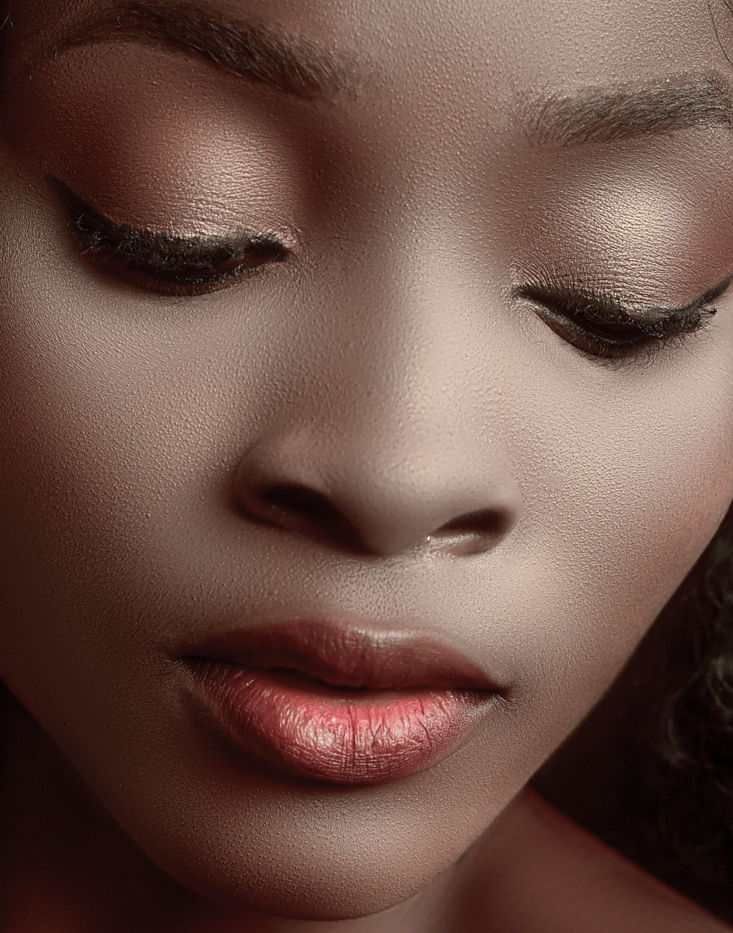 A Close Up Shot of a Woman's Face Looking Down · Free Stock Photo