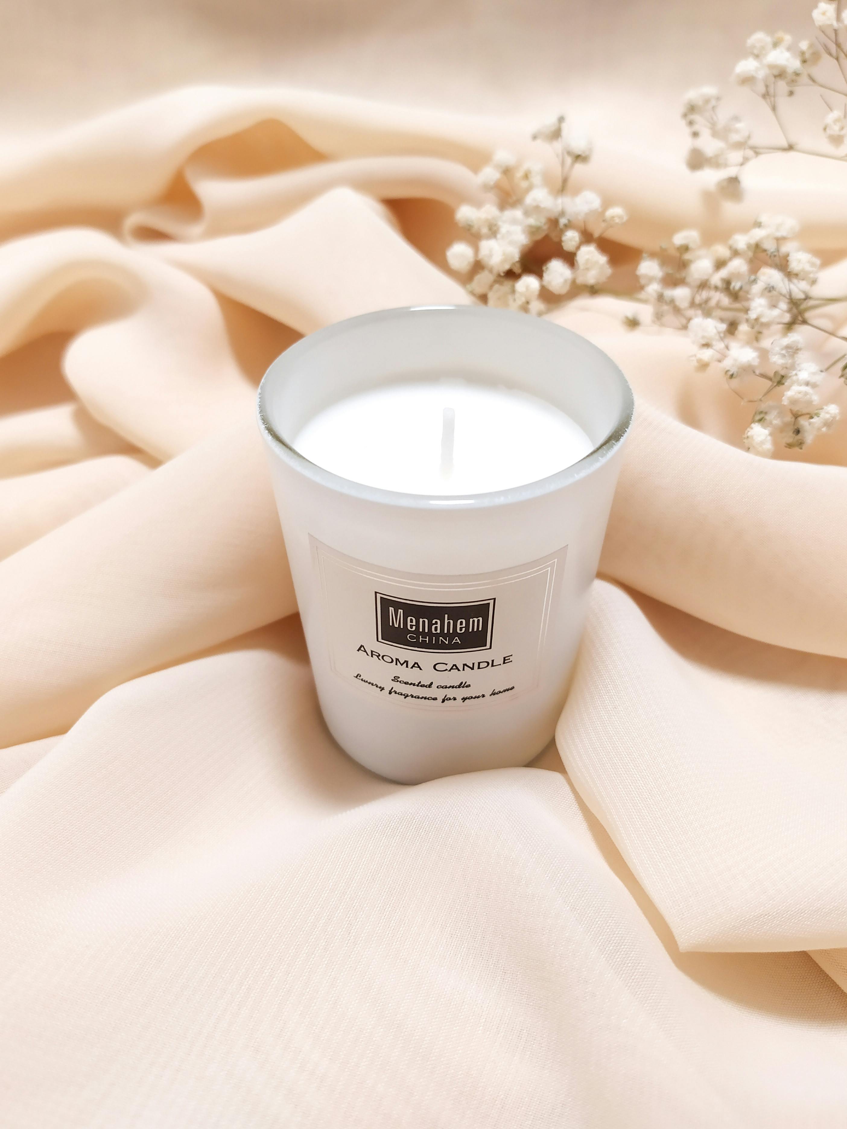 A White Candle with a Cloth Background · Free Stock Photo