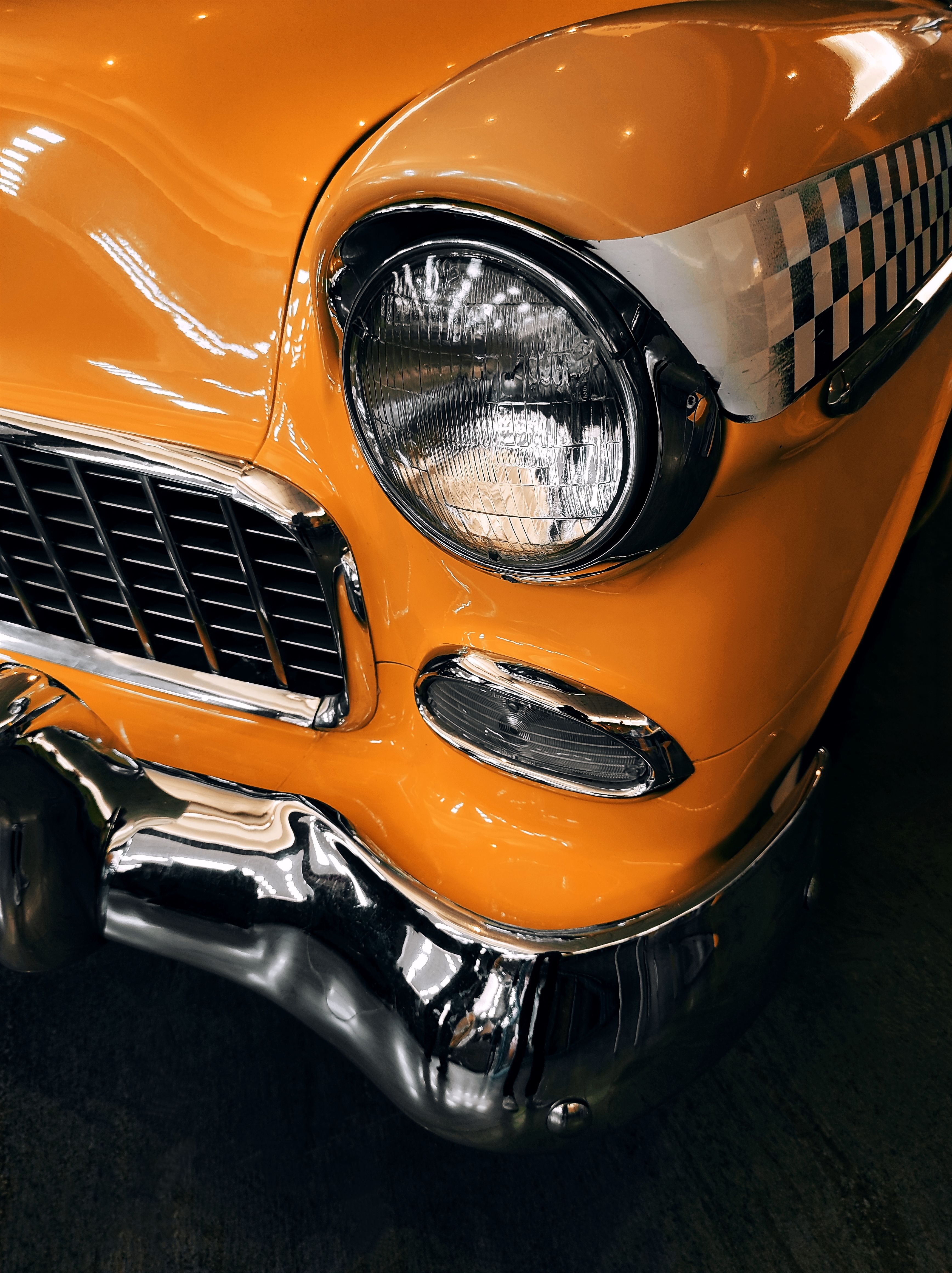 A Yellow Car With a Chrome Headlight and Bumper · Free Stock Photo
