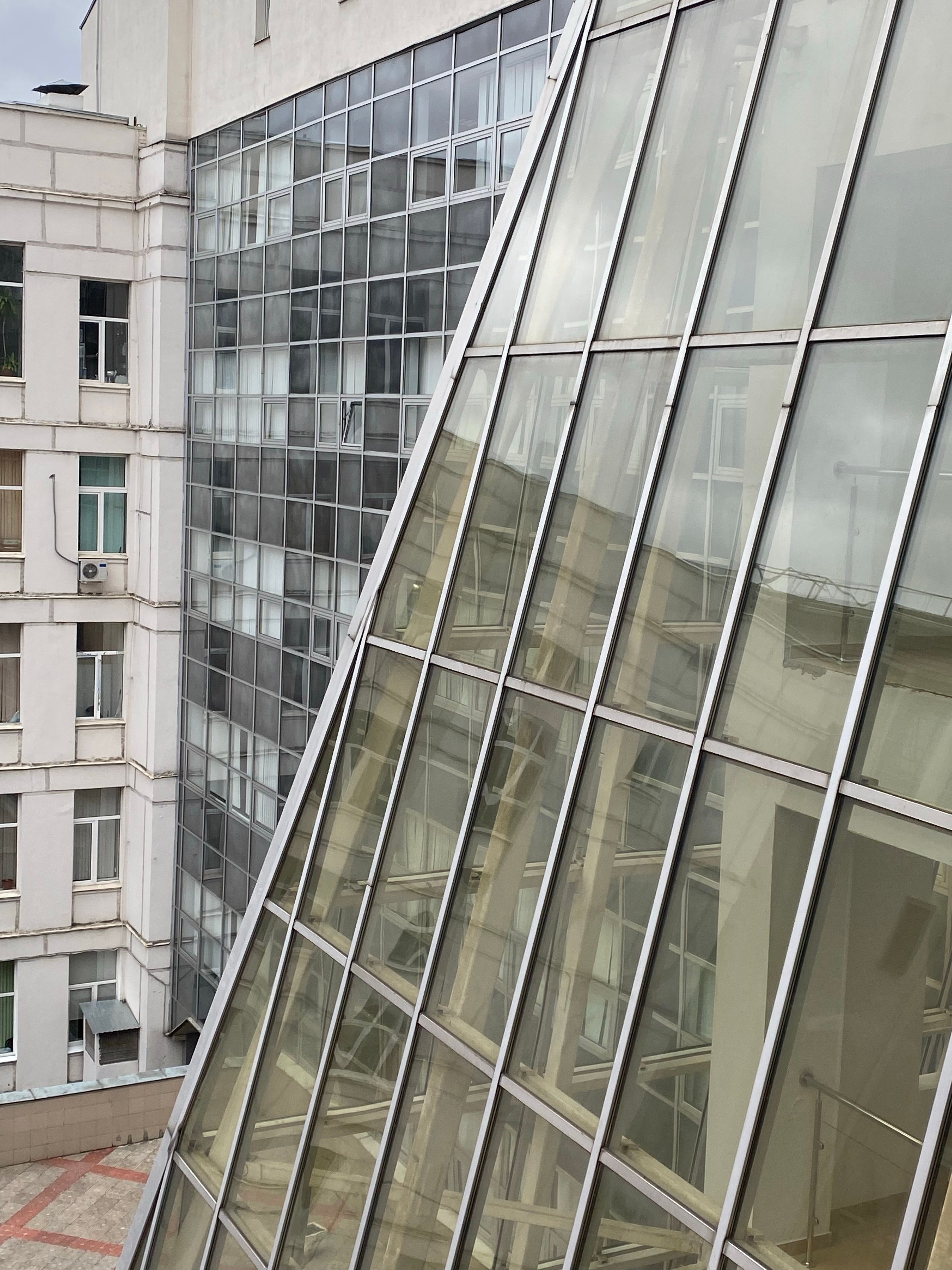 Fish Eye View Photo of Glass High Story Building over White Cloudy Sky ...