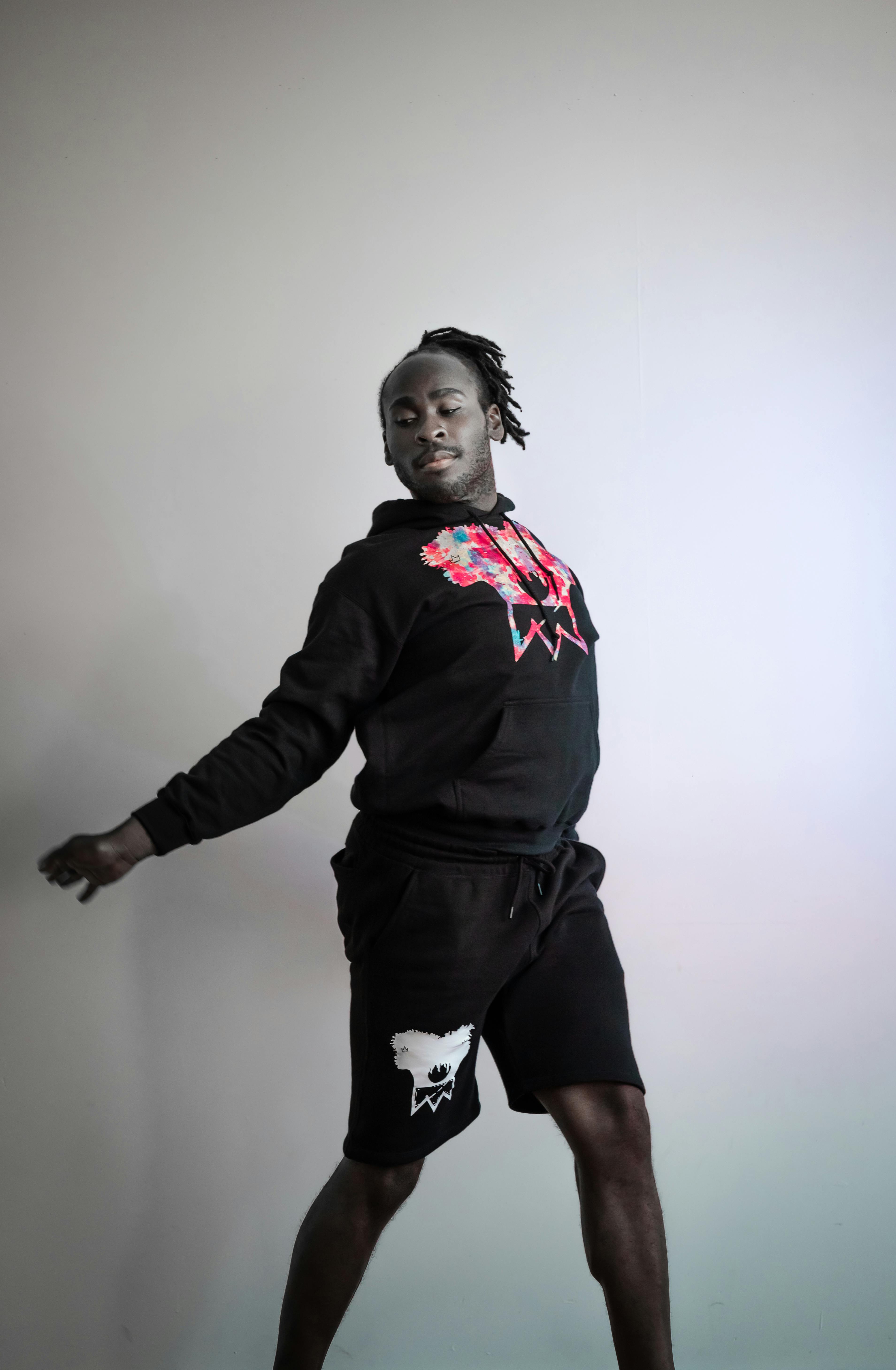 A Rapper Wearing a Hoodie Sweater · Free Stock Photo