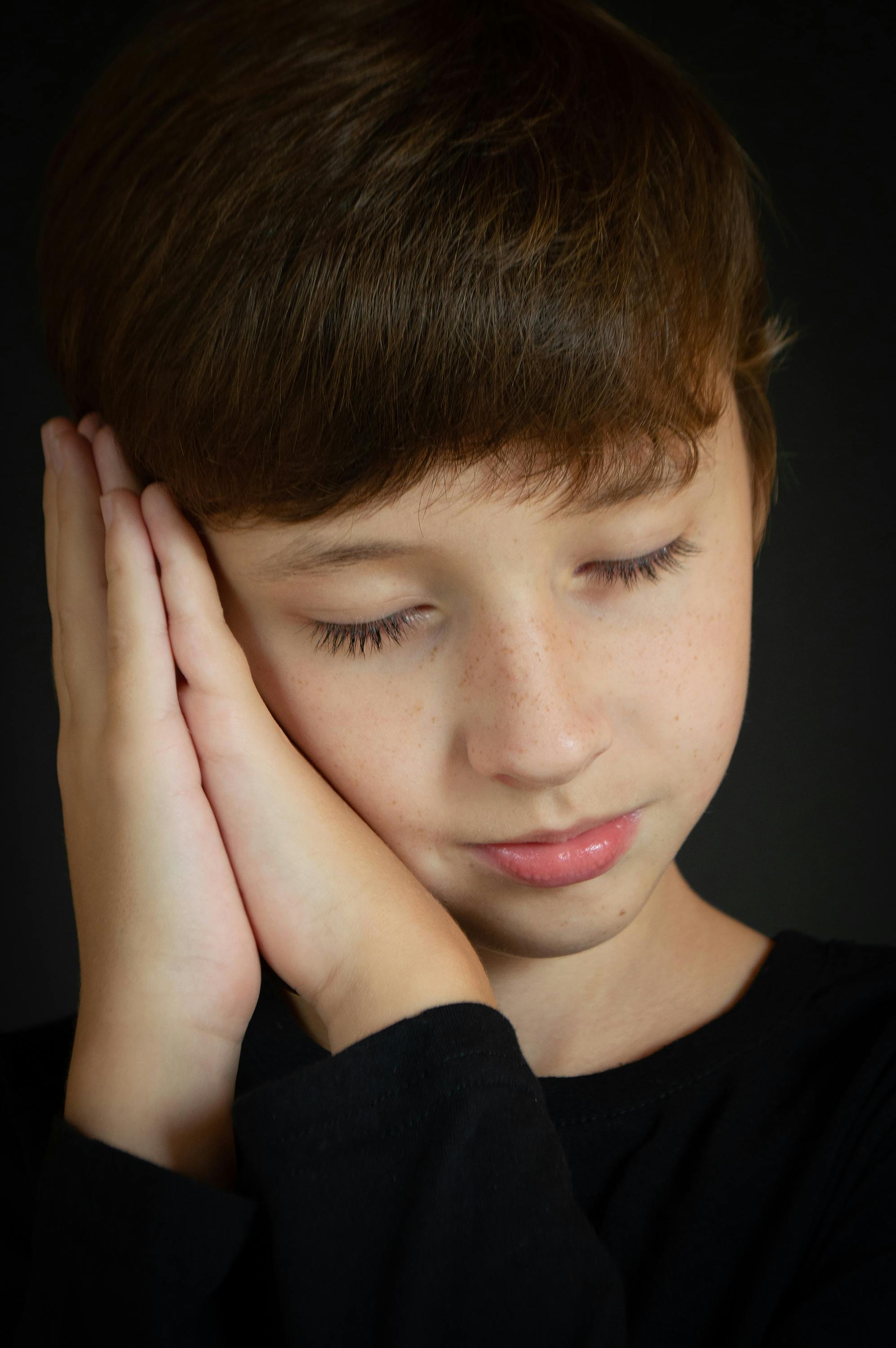 A Close-Up Shot of a Boy with His Eyes Closed · Free Stock Photo