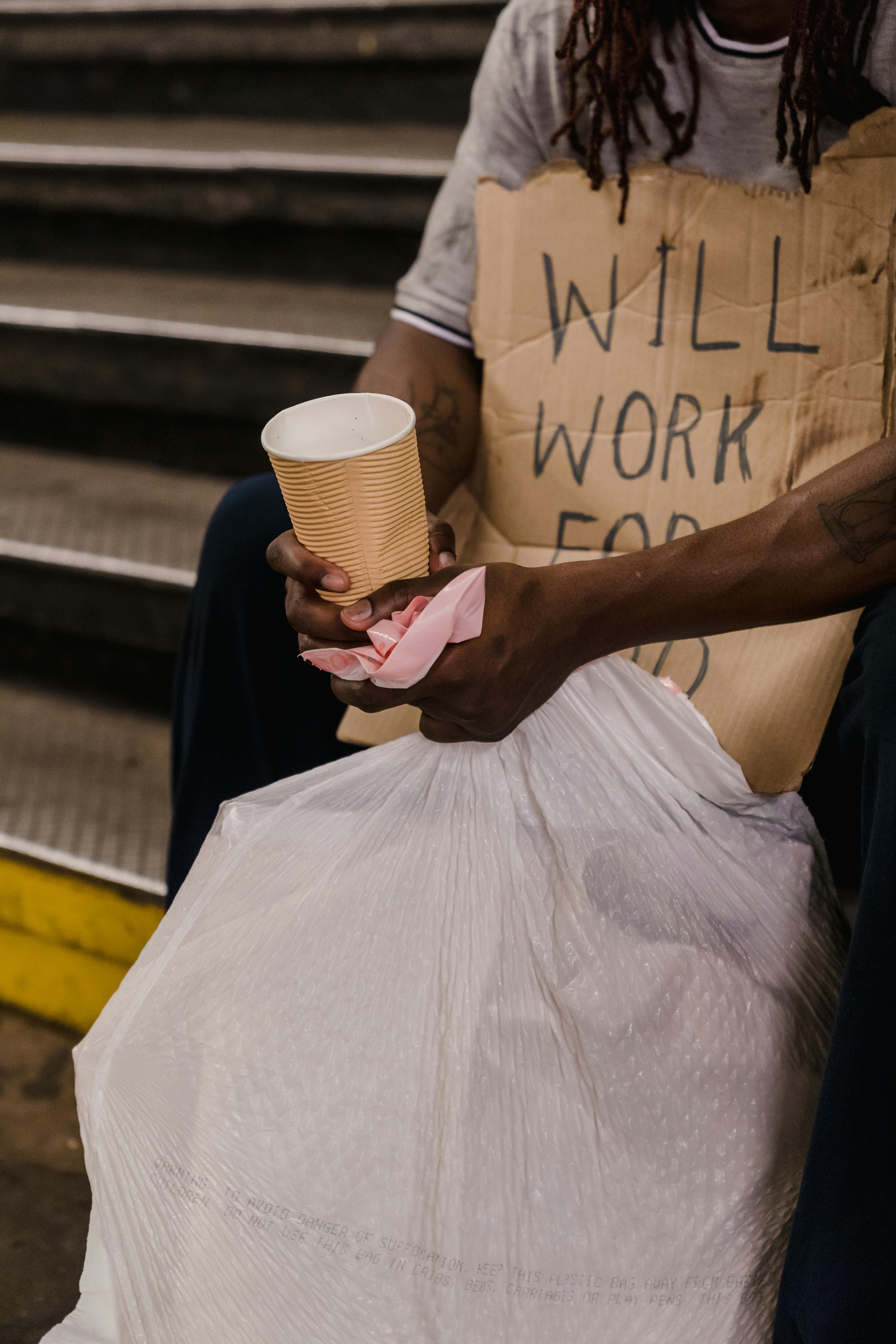 Man with Placard Begging on Street · Free Stock Photo