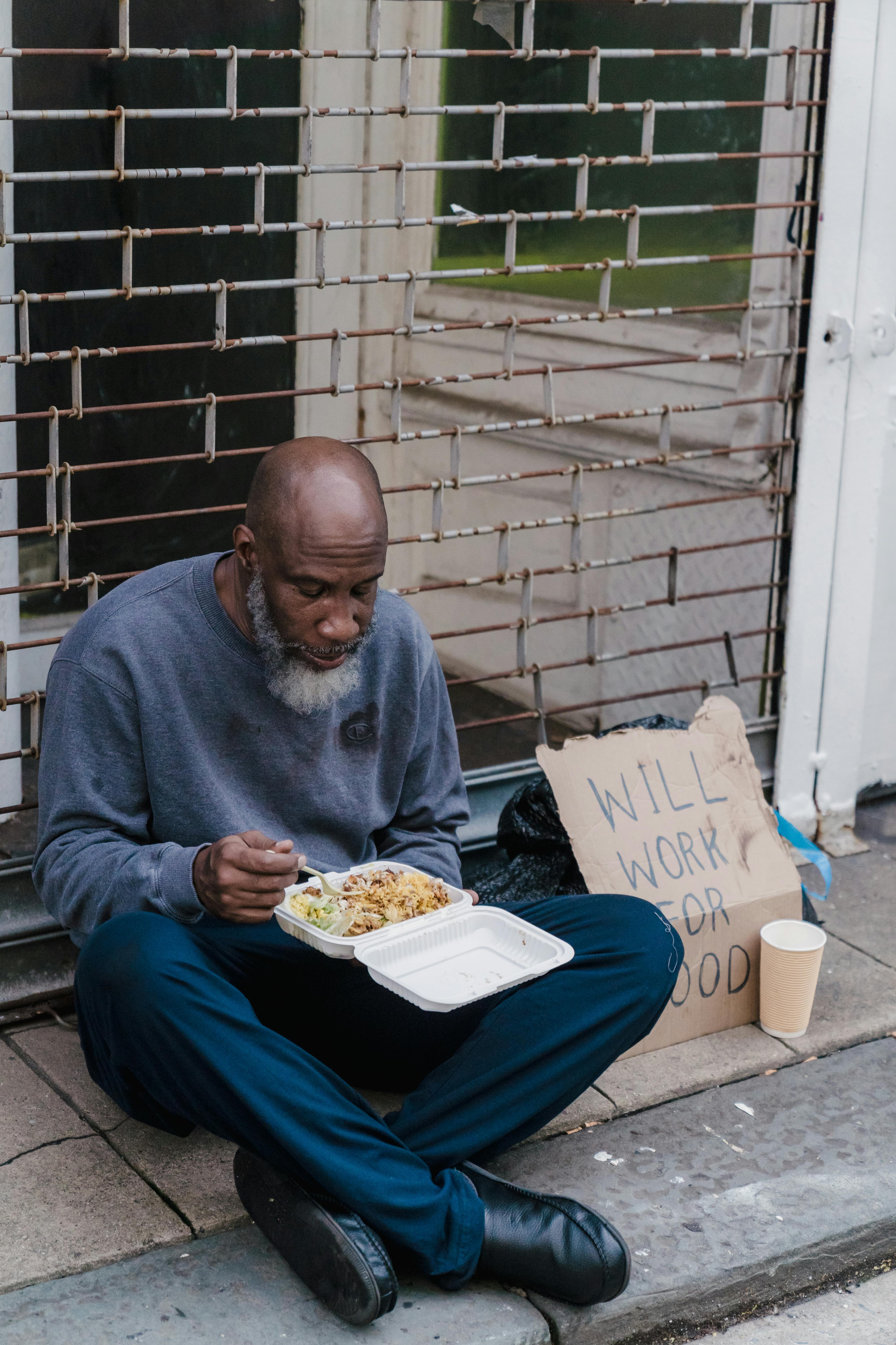Man Eating Meal at Sidewalk · Free Stock Photo