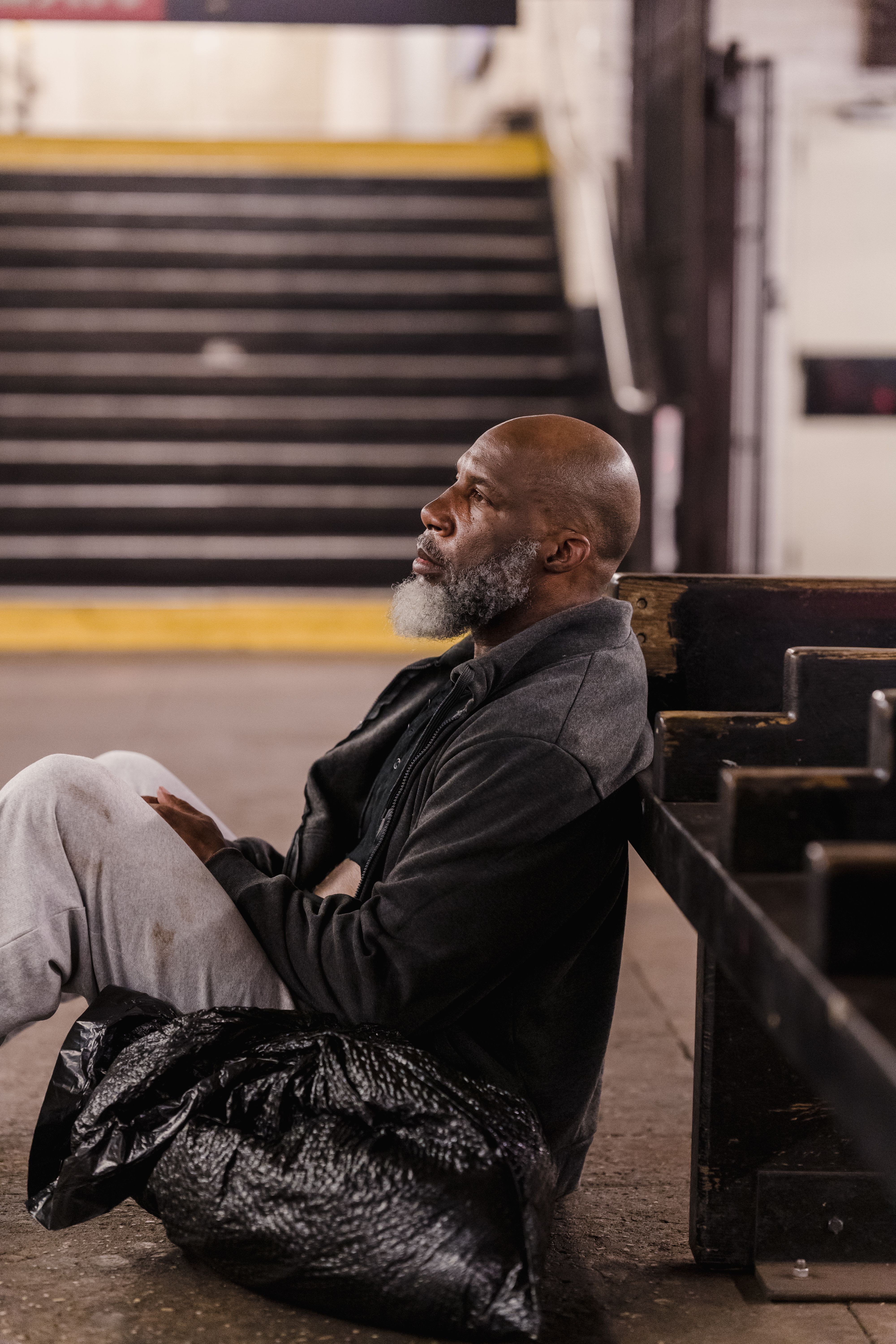 A Man Sitting on the Ground · Free Stock Photo