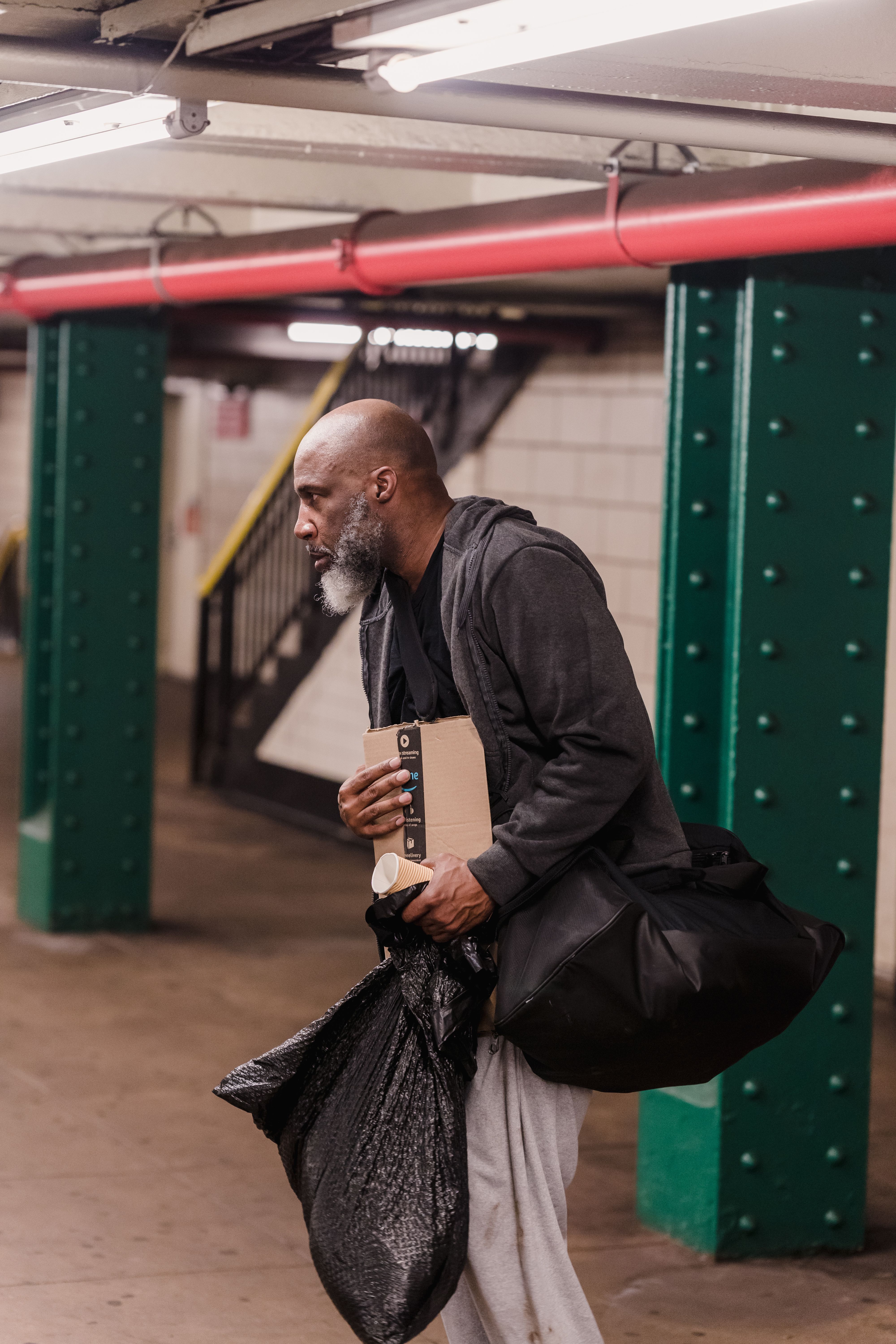 Man Holding Bag at Subway Station · Free Stock Photo