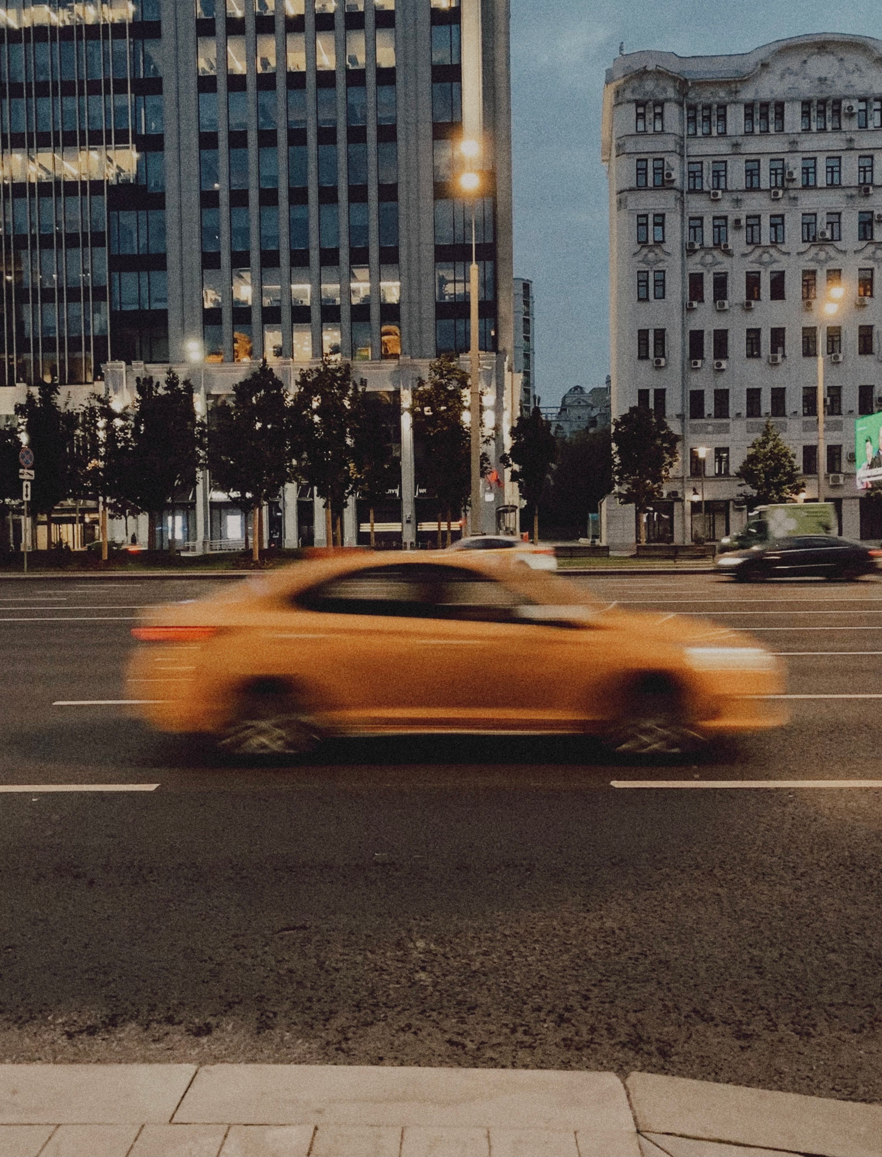 Yellow Car Passing by the Road · Free Stock Photo