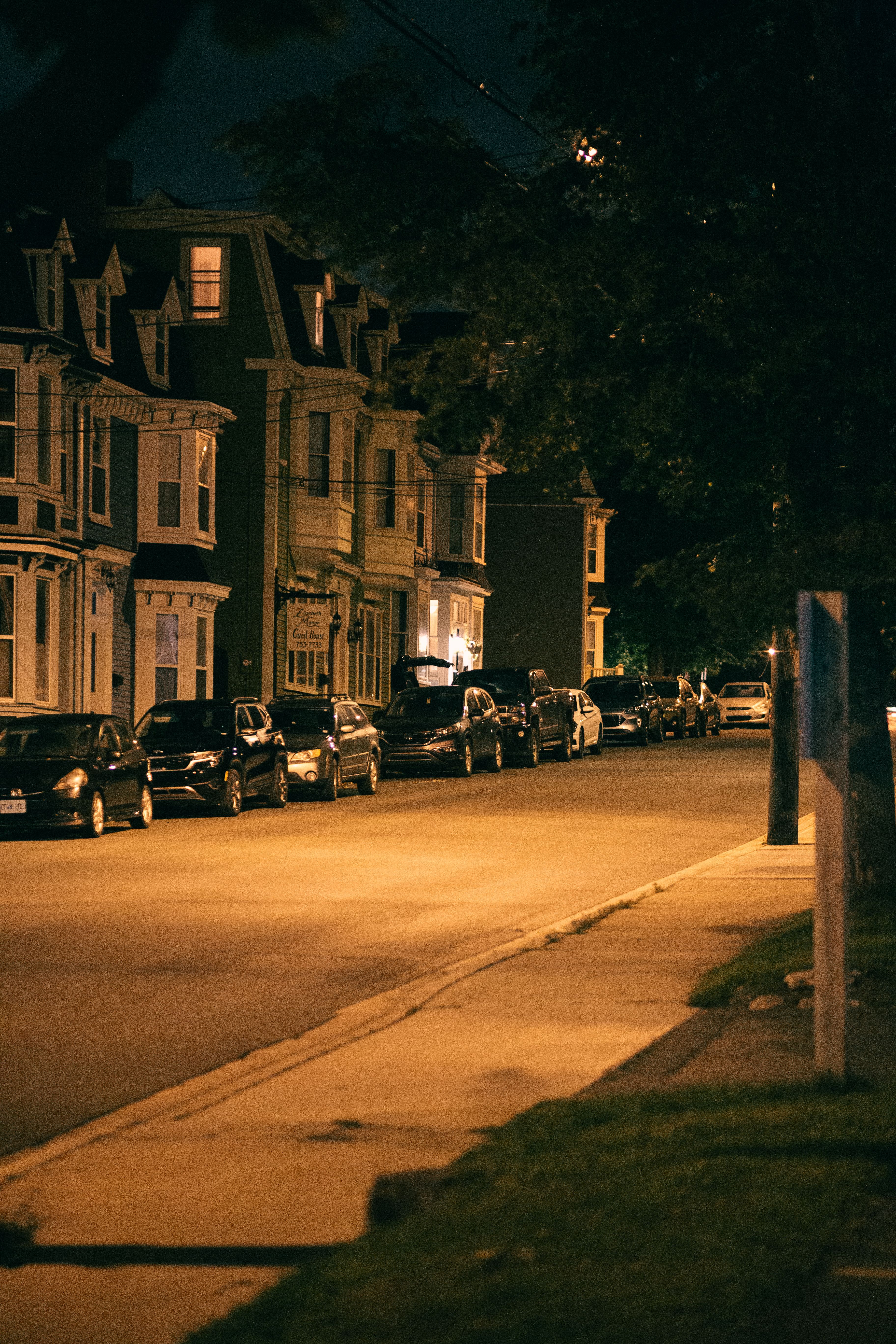 Cars driving on street in suburb at night · Free Stock Photo