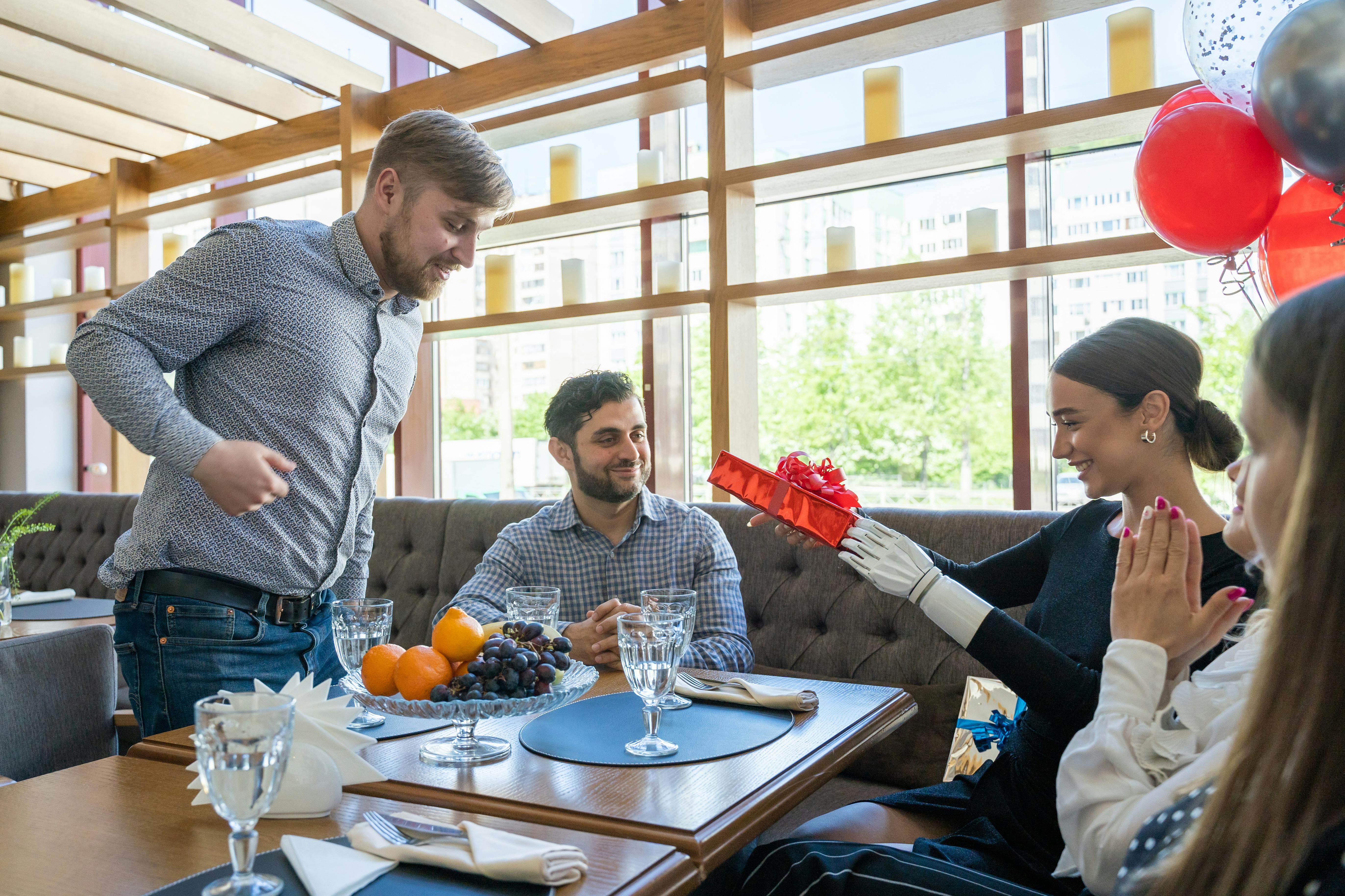 Woman giving a Present to a Friend · Free Stock Photo