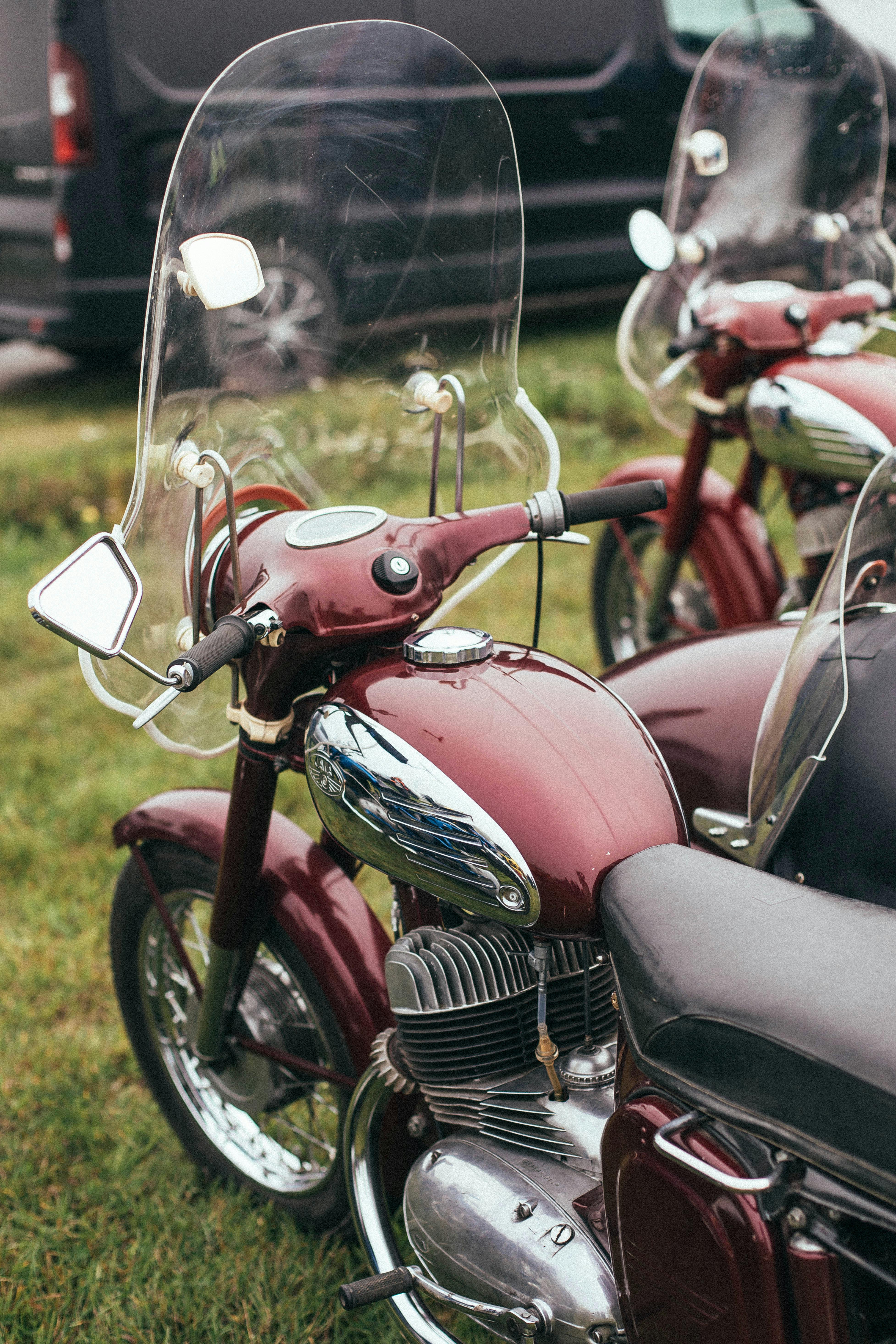 Motorcycles Parked on Green Grass · Free Stock Photo
