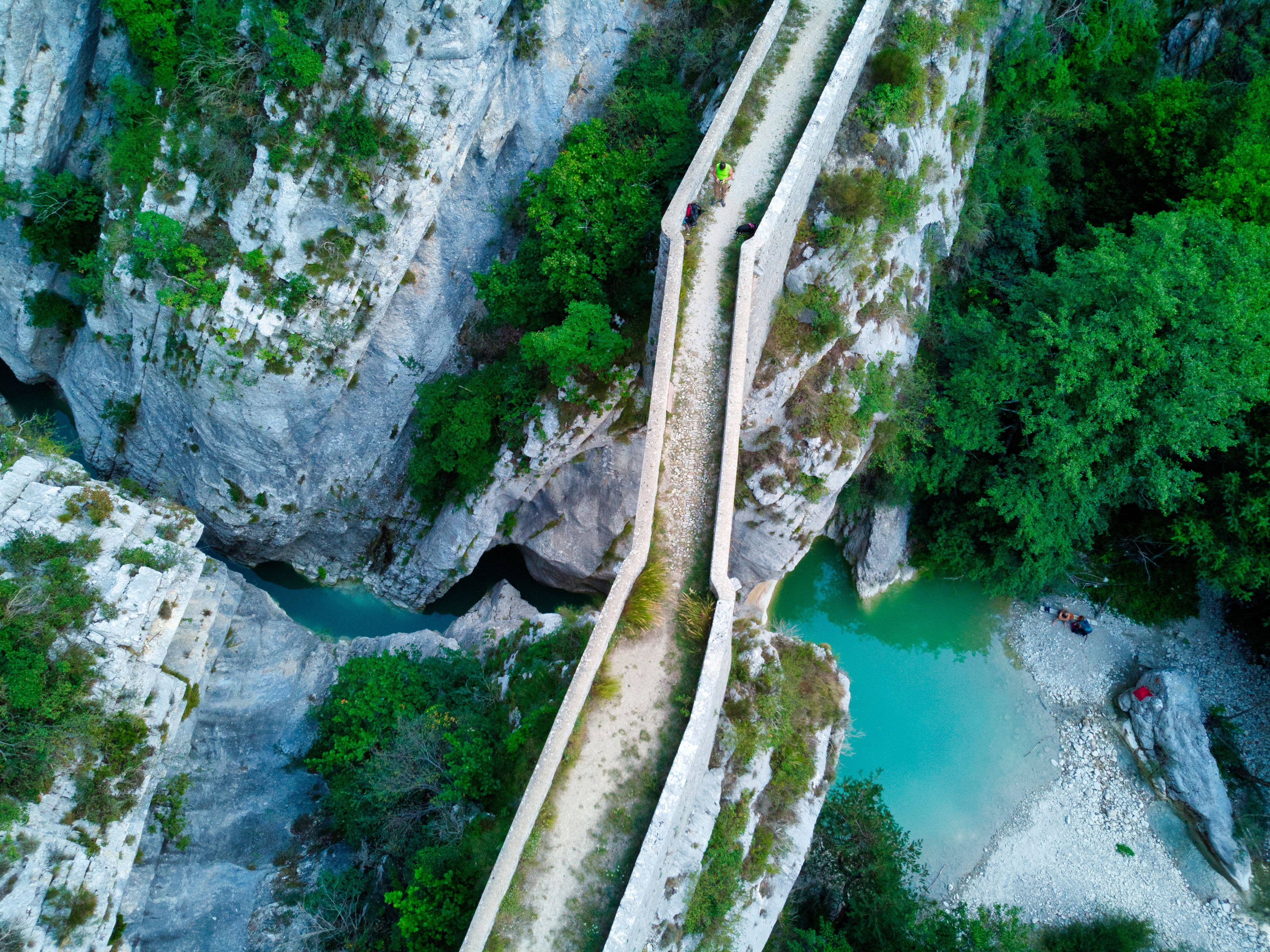 Long Wooden Bridge Over Blue Water of Plitvice Lakes in a National Park ...