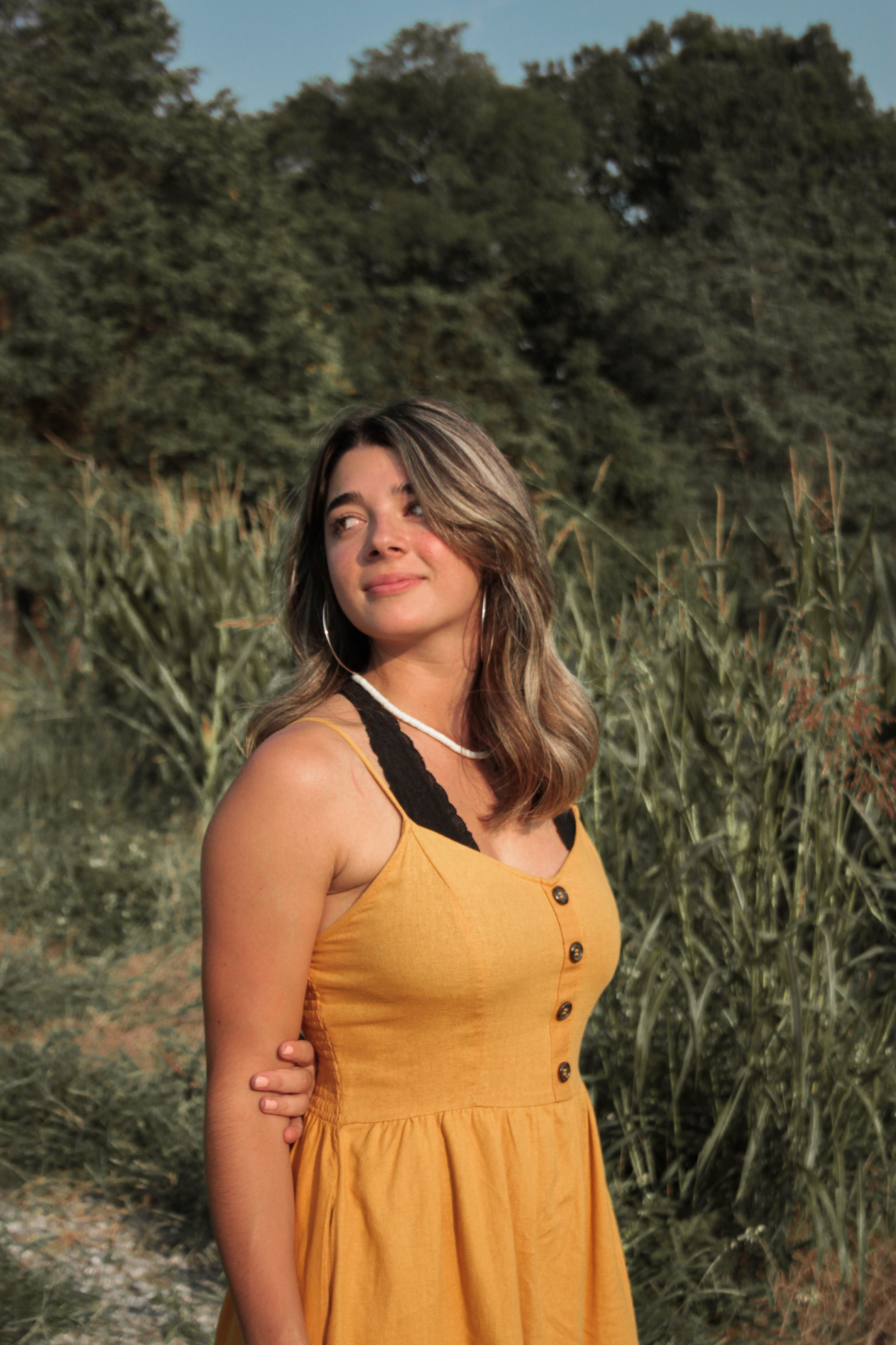A Woman in Yellow Dress Smiling · Free Stock Photo