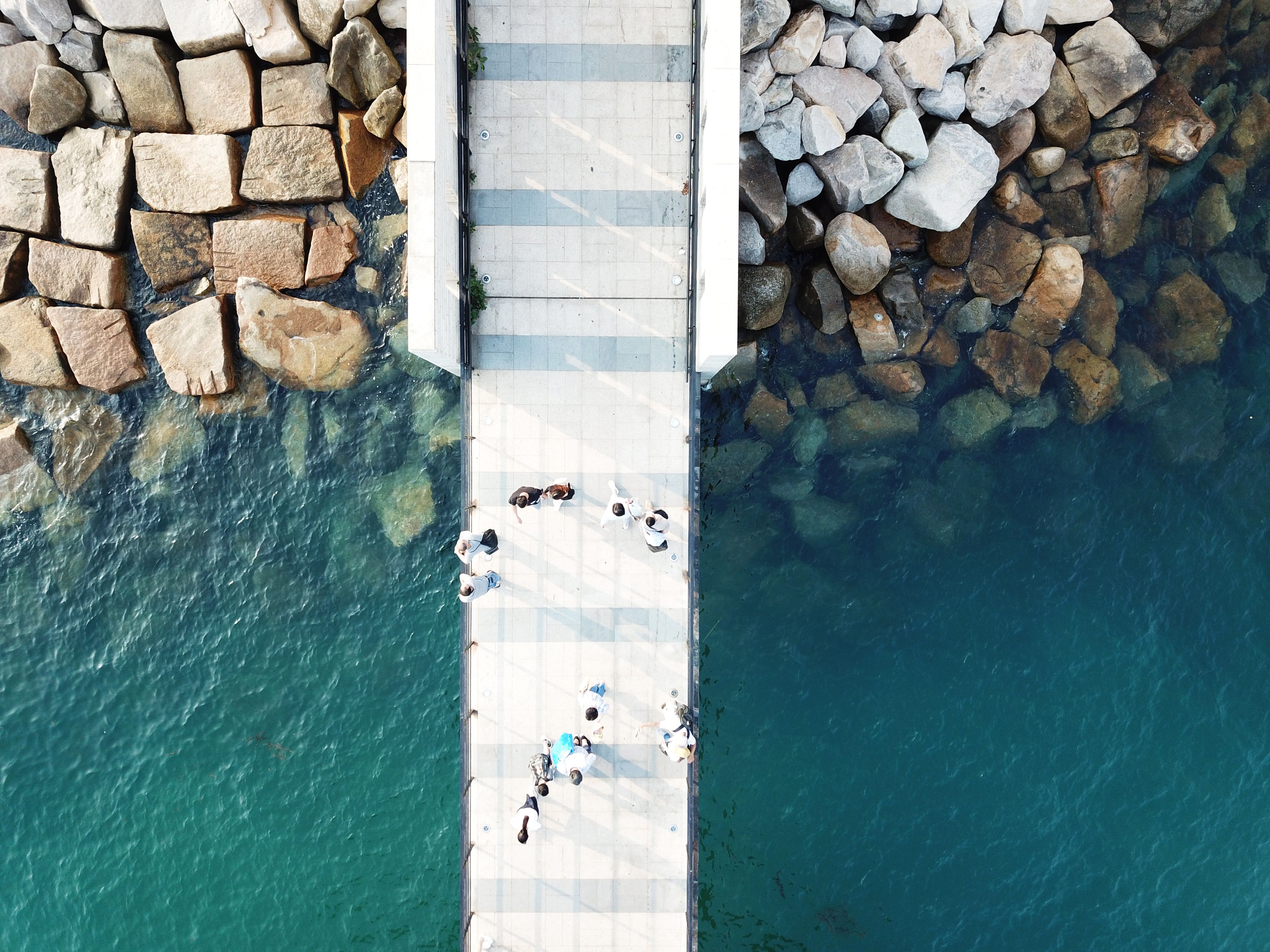 Aerial View of People Walking in a Bridge · Free Stock Photo