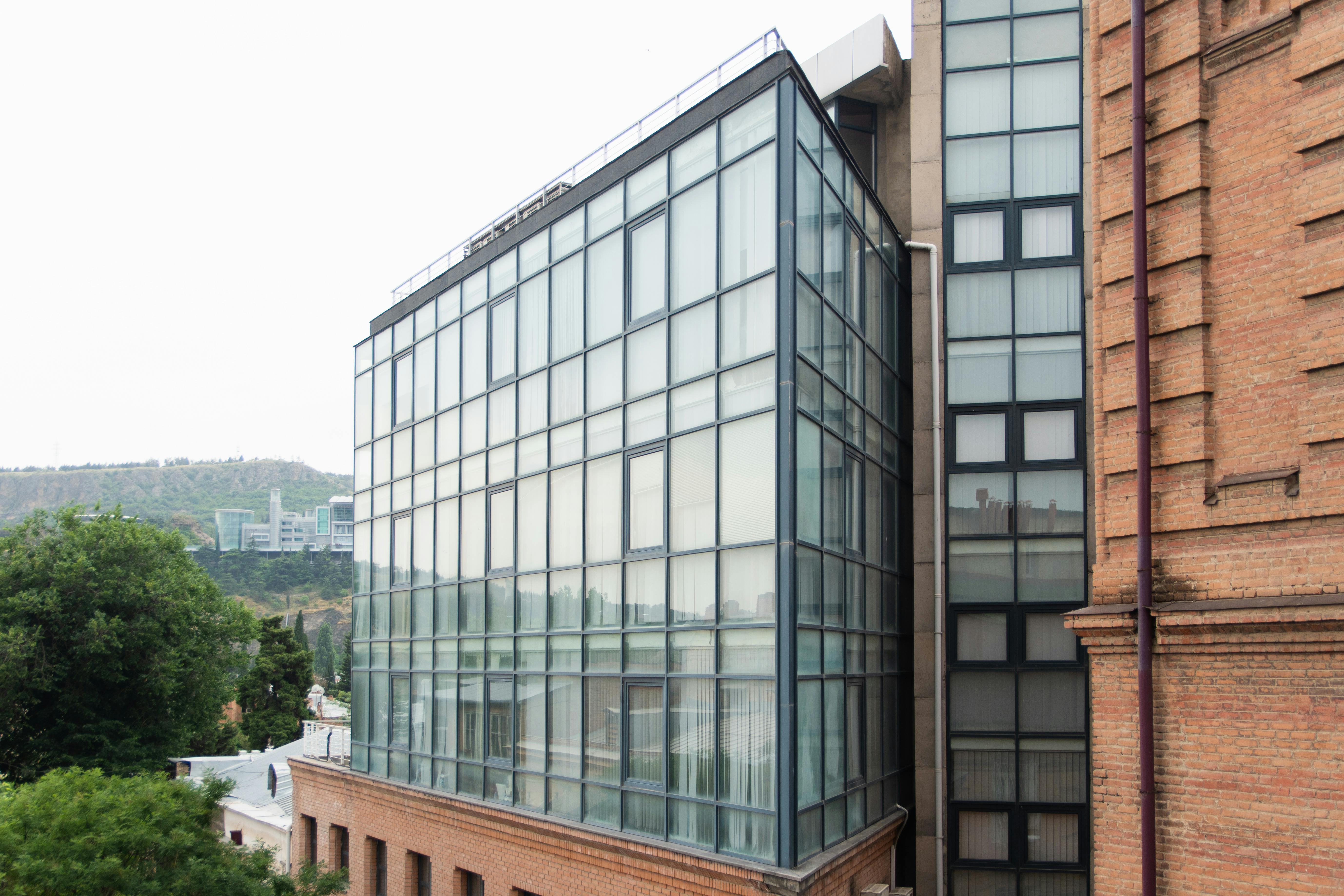 Modern Brick Building with Glass Windows · Free Stock Photo