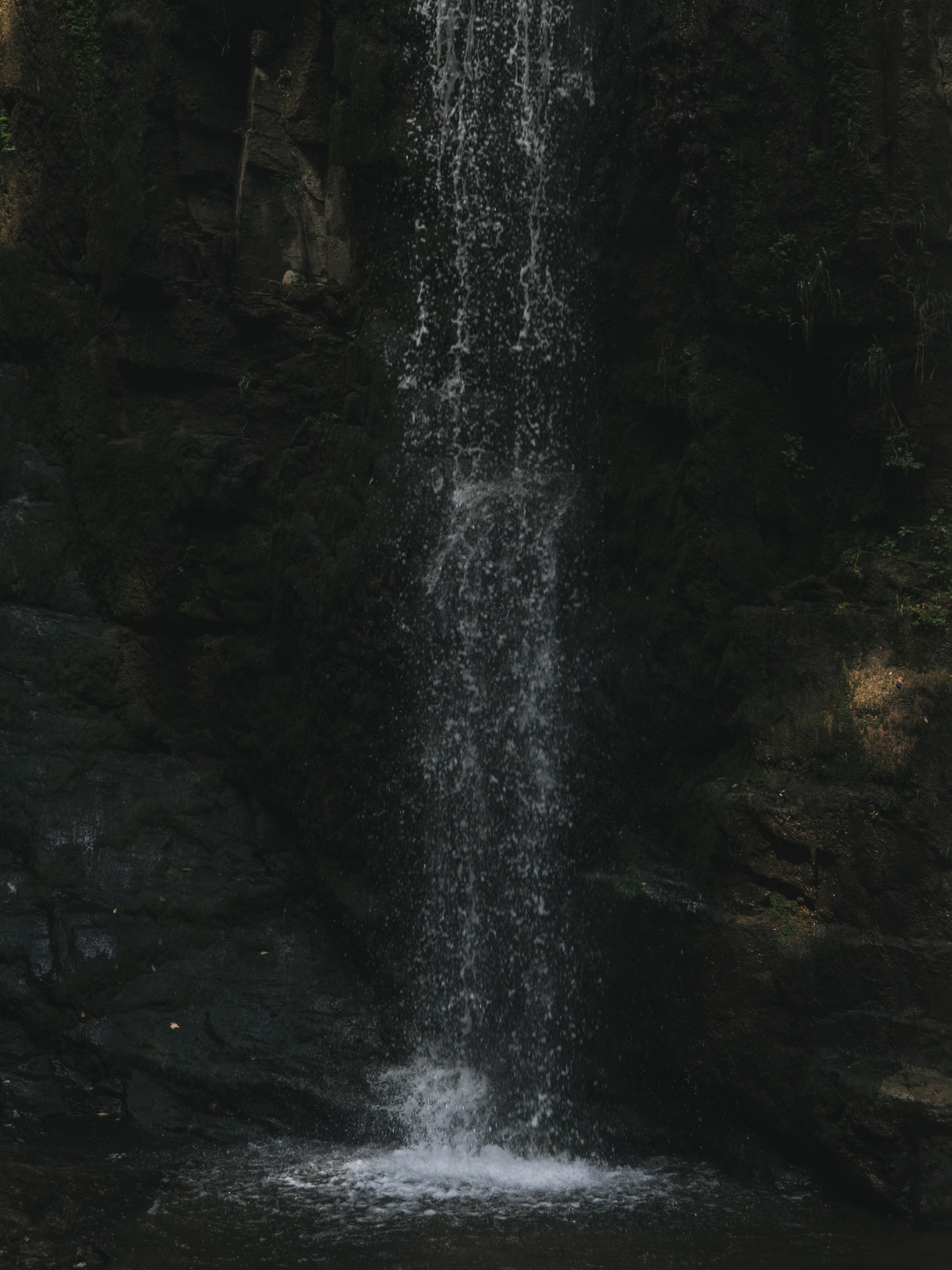 Close-up of Water Splashing Against Black Background · Free Stock Photo
