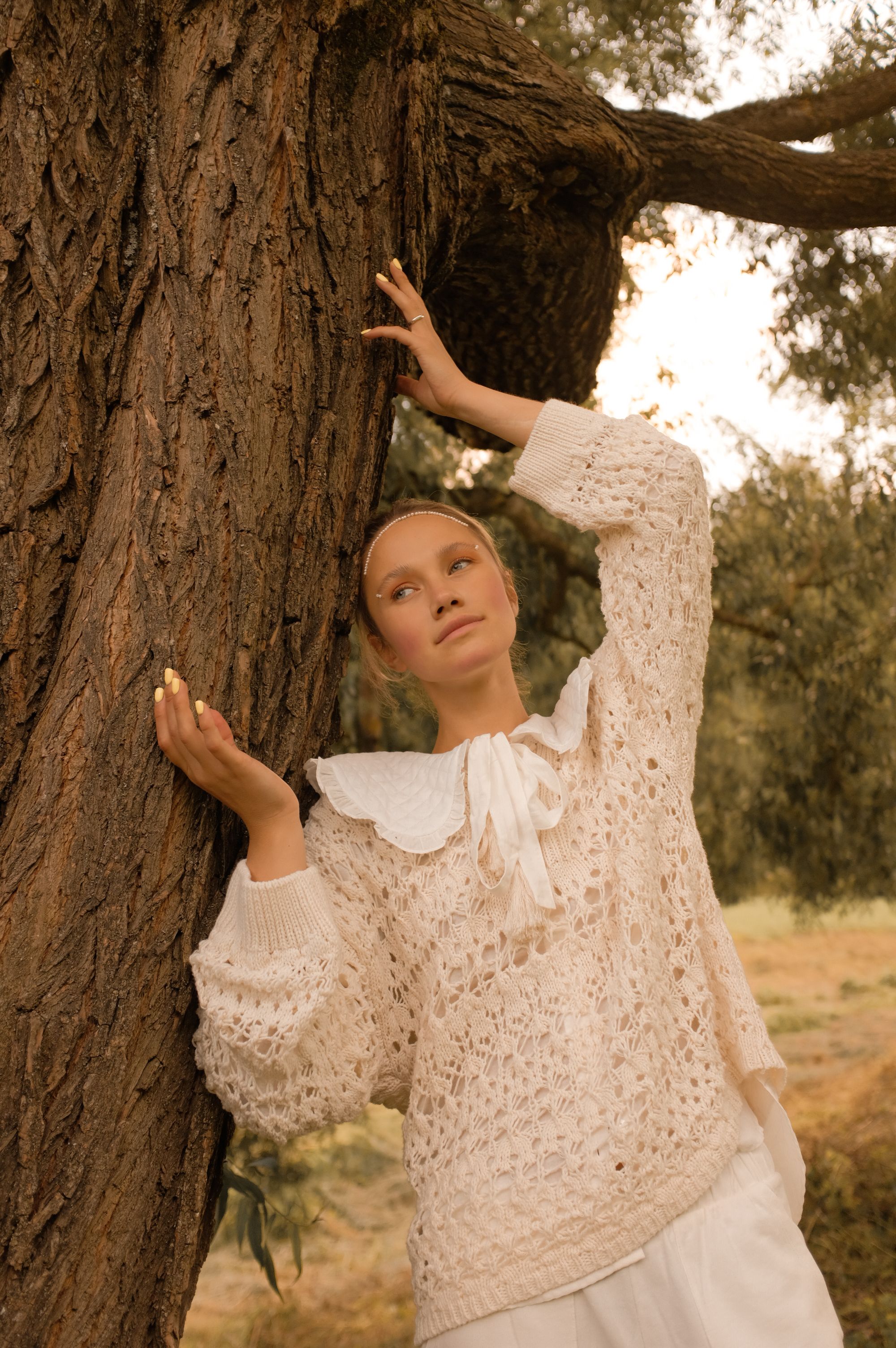 Low angle view of woman with hands raised · Free Stock Photo
