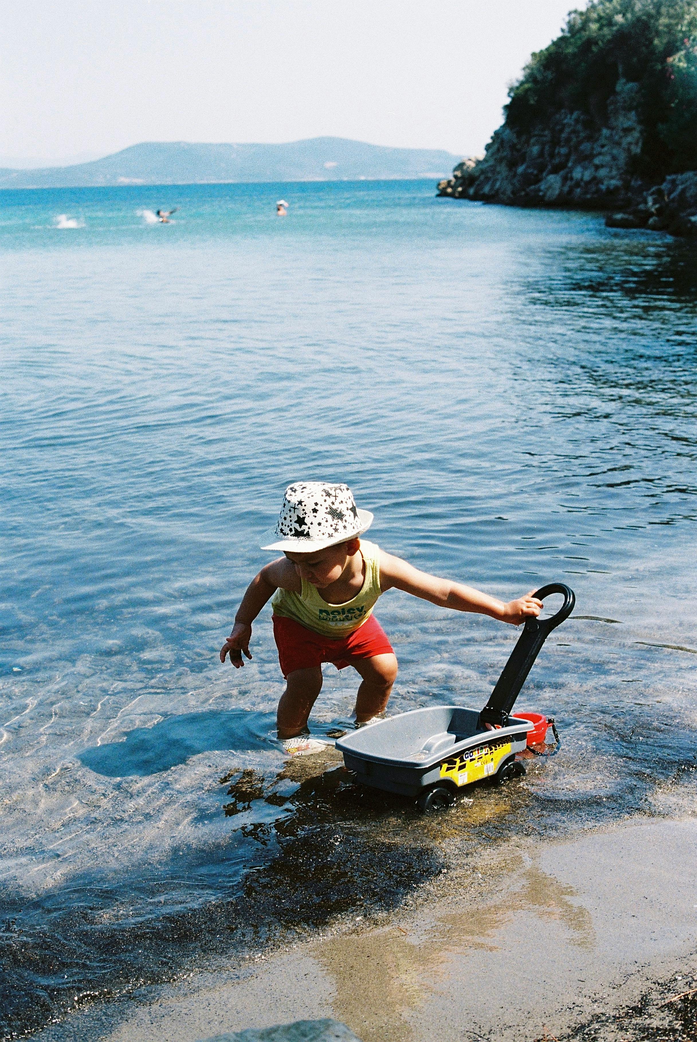 Children Running with a DIY Cardboard Box Costume · Free Stock Photo