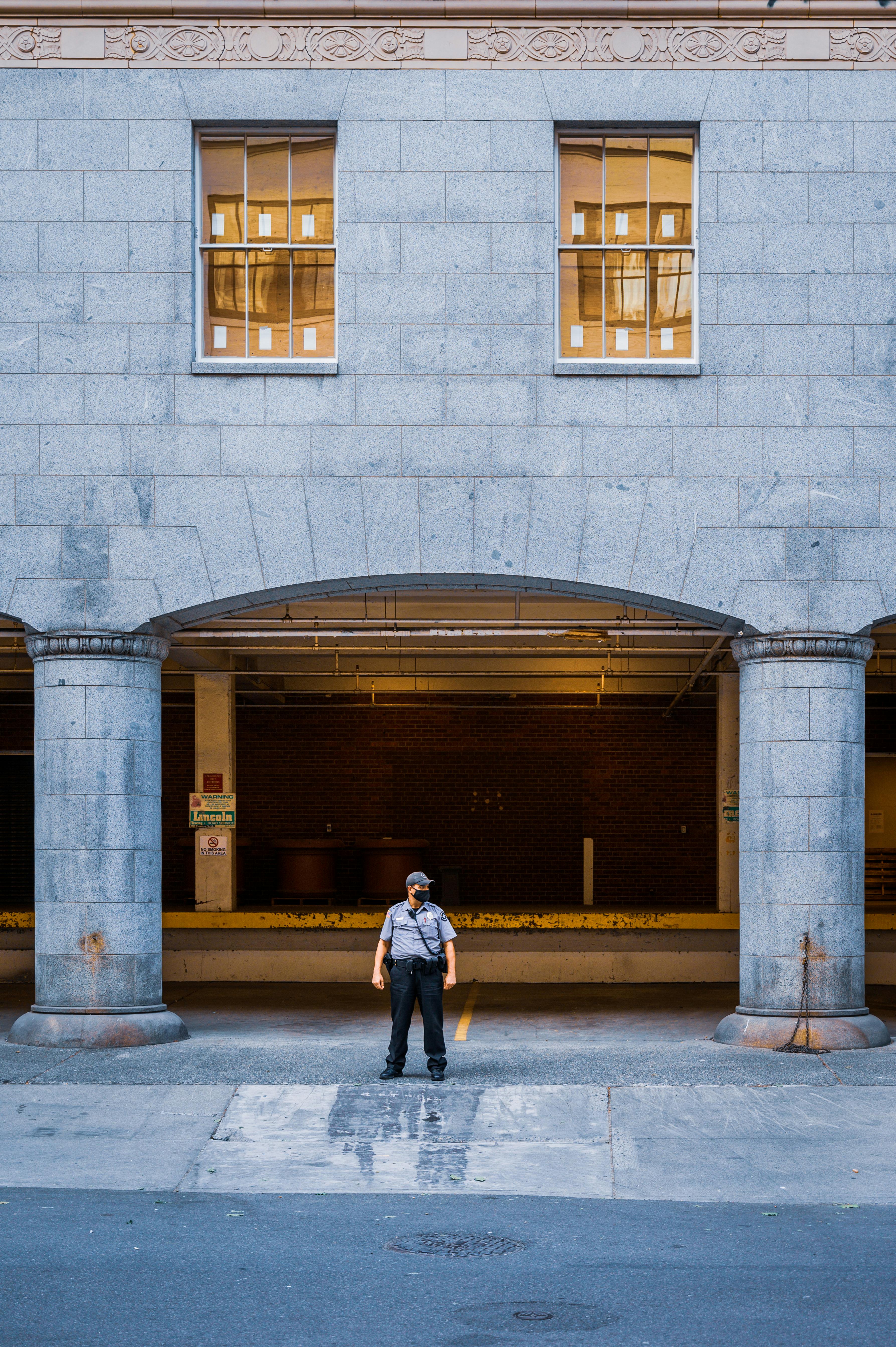 People Walking on Street Near White Concrete Building · Free Stock Photo
