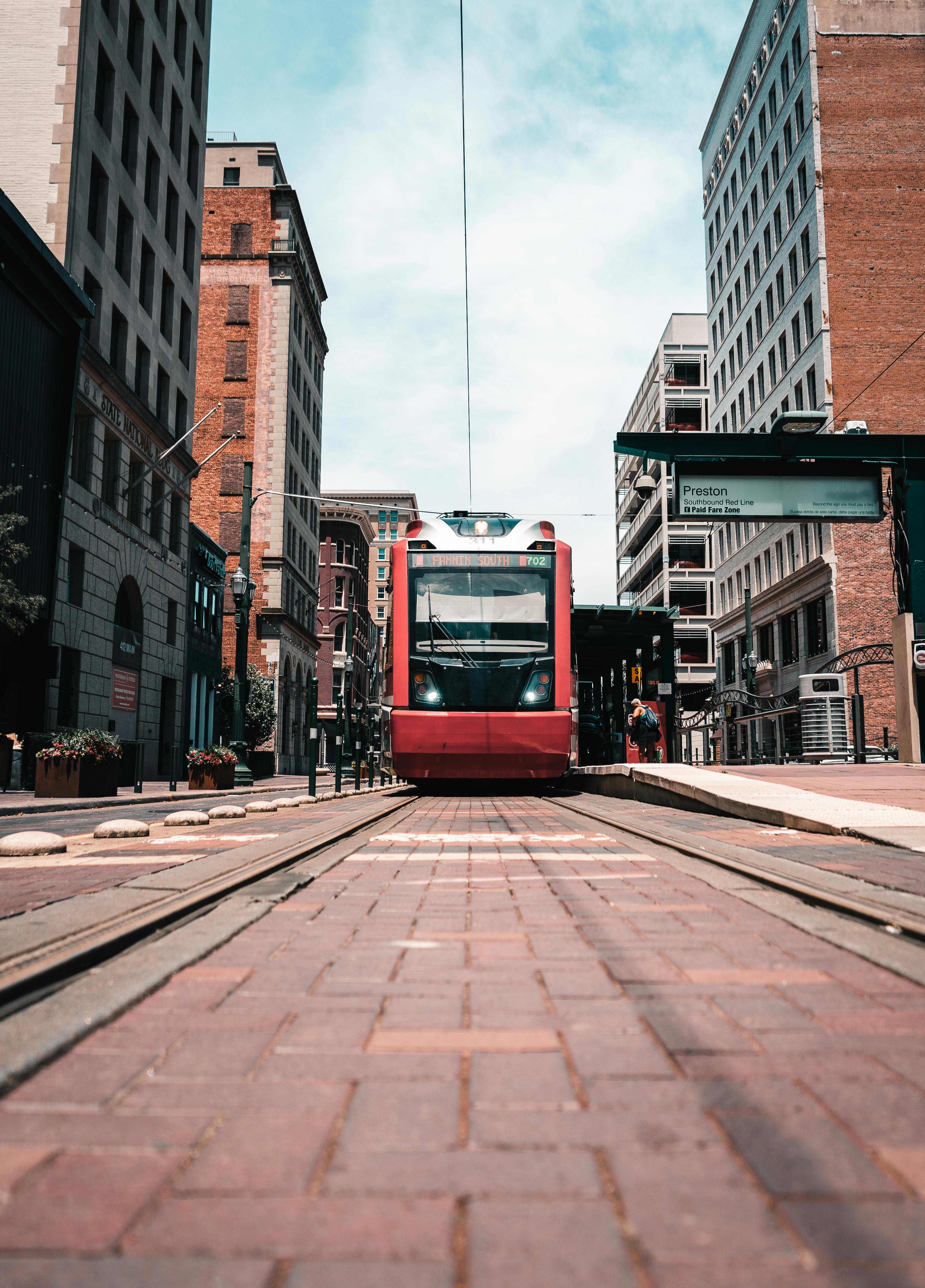 Red and Black Tram on Road · Free Stock Photo