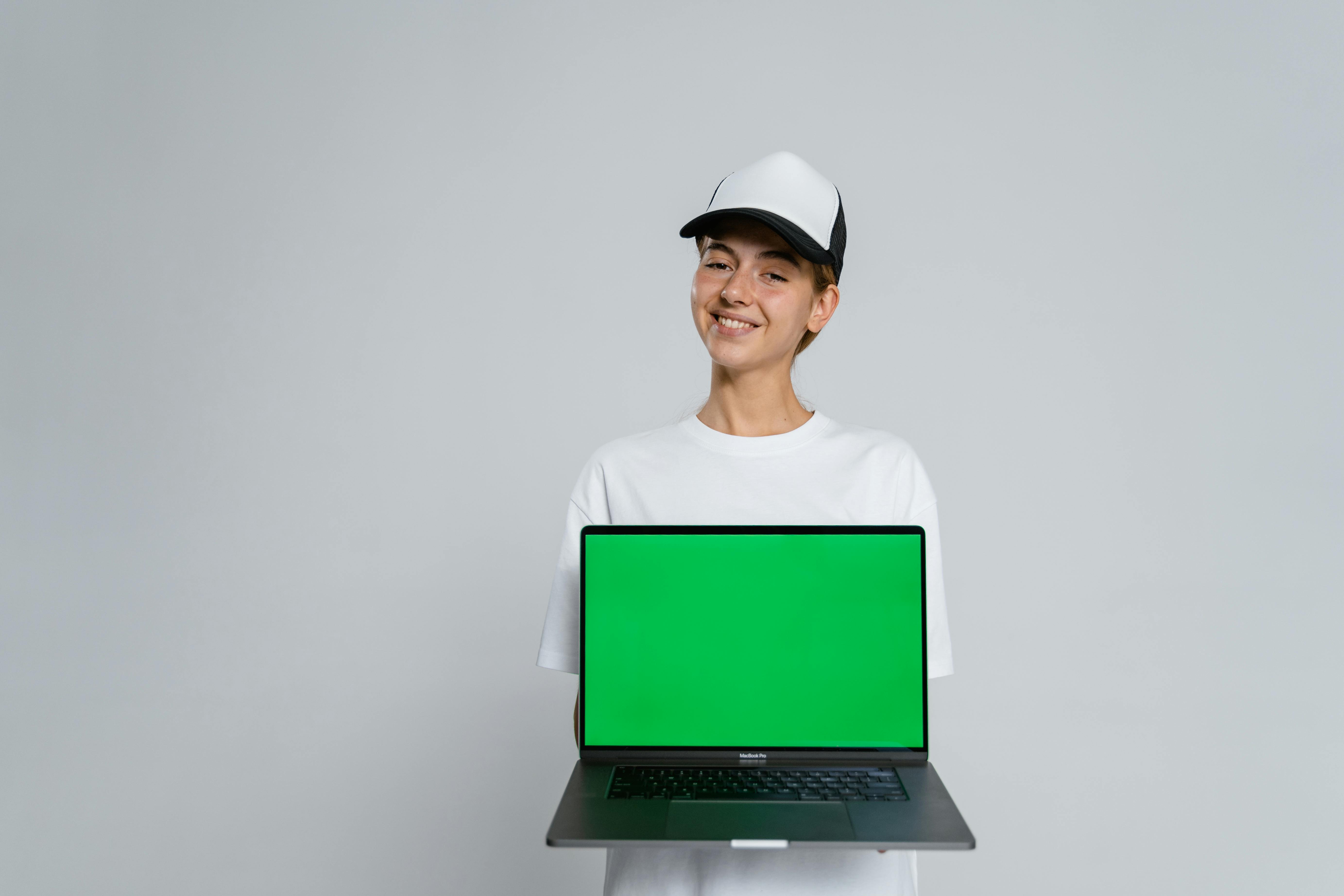 A Woman Holding a Laptop · Free Stock Photo