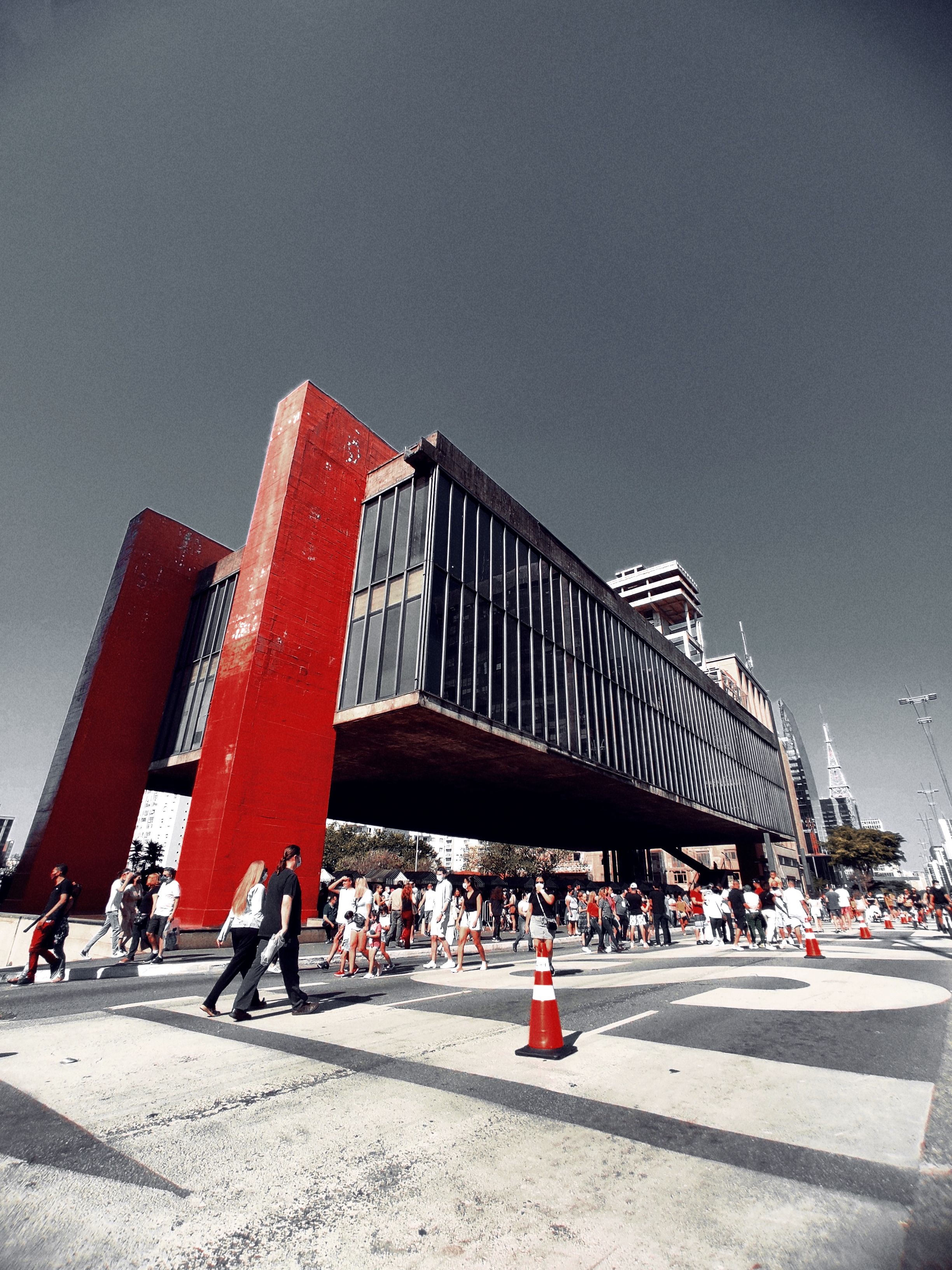 People Walking on Street Near Red Building · Free Stock Photo
