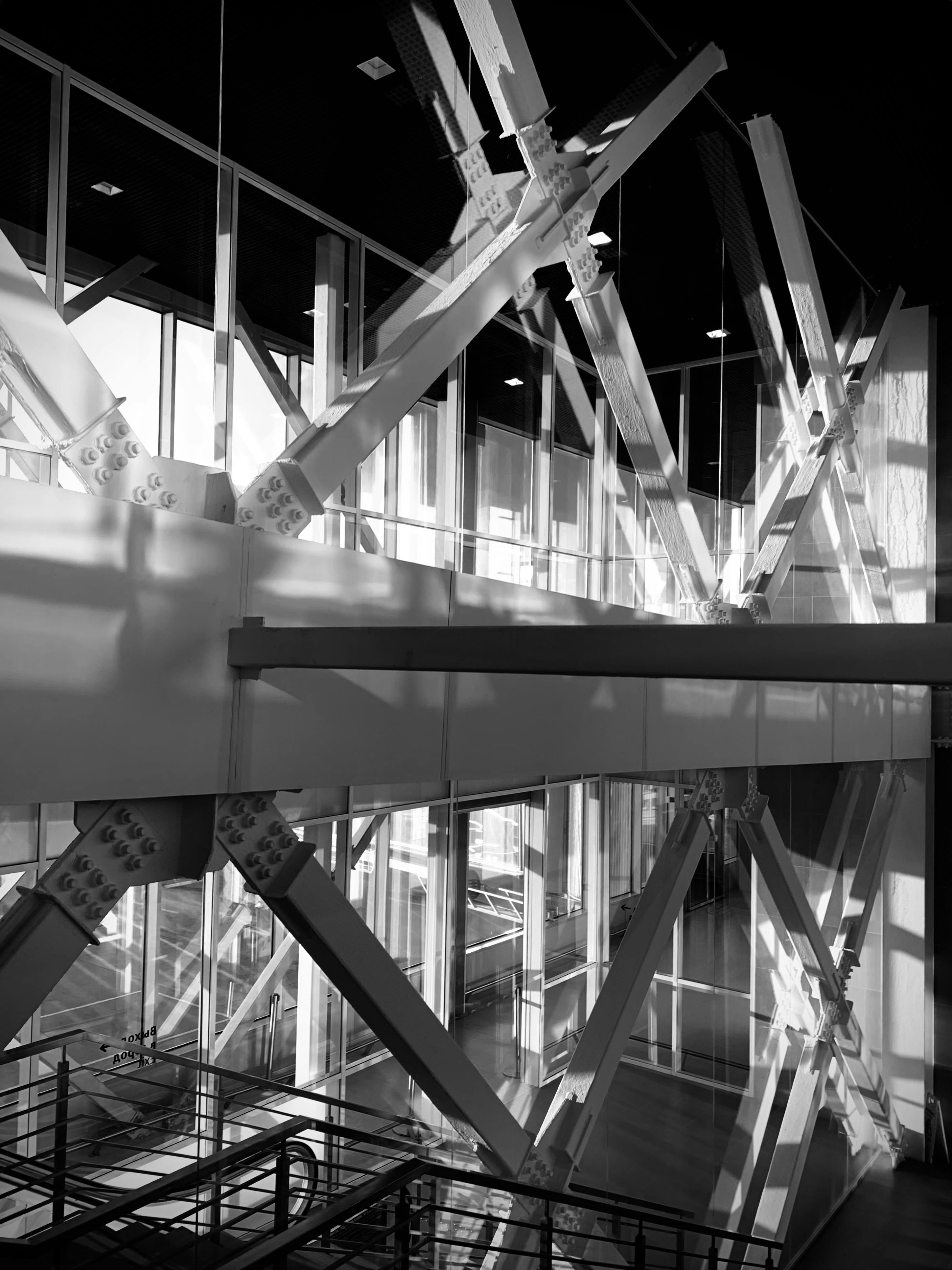 Grayscale Photo of Steel Structure in the Building · Free Stock Photo