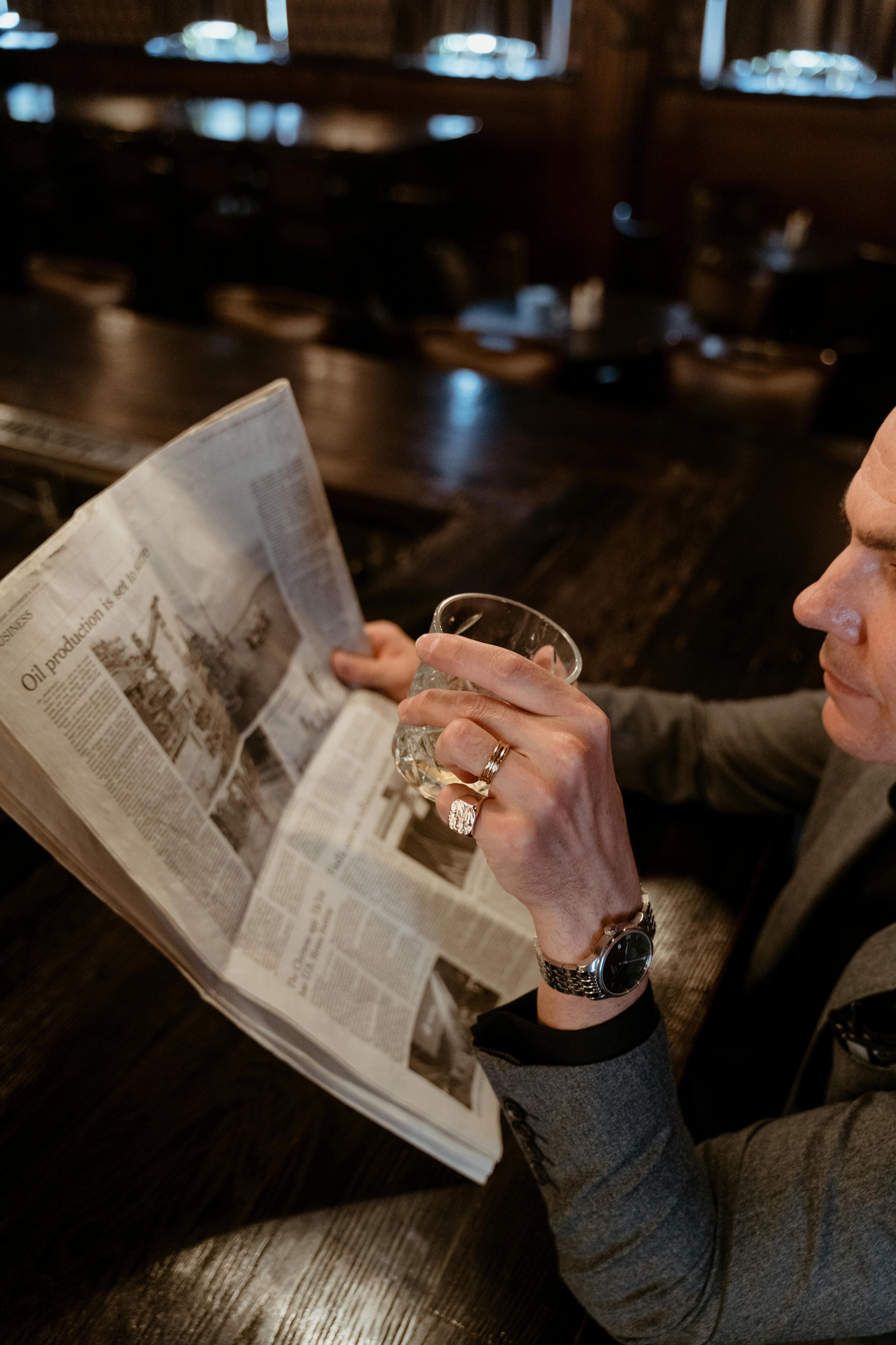 Close-up of People Reading Newspaper · Free Stock Photo
