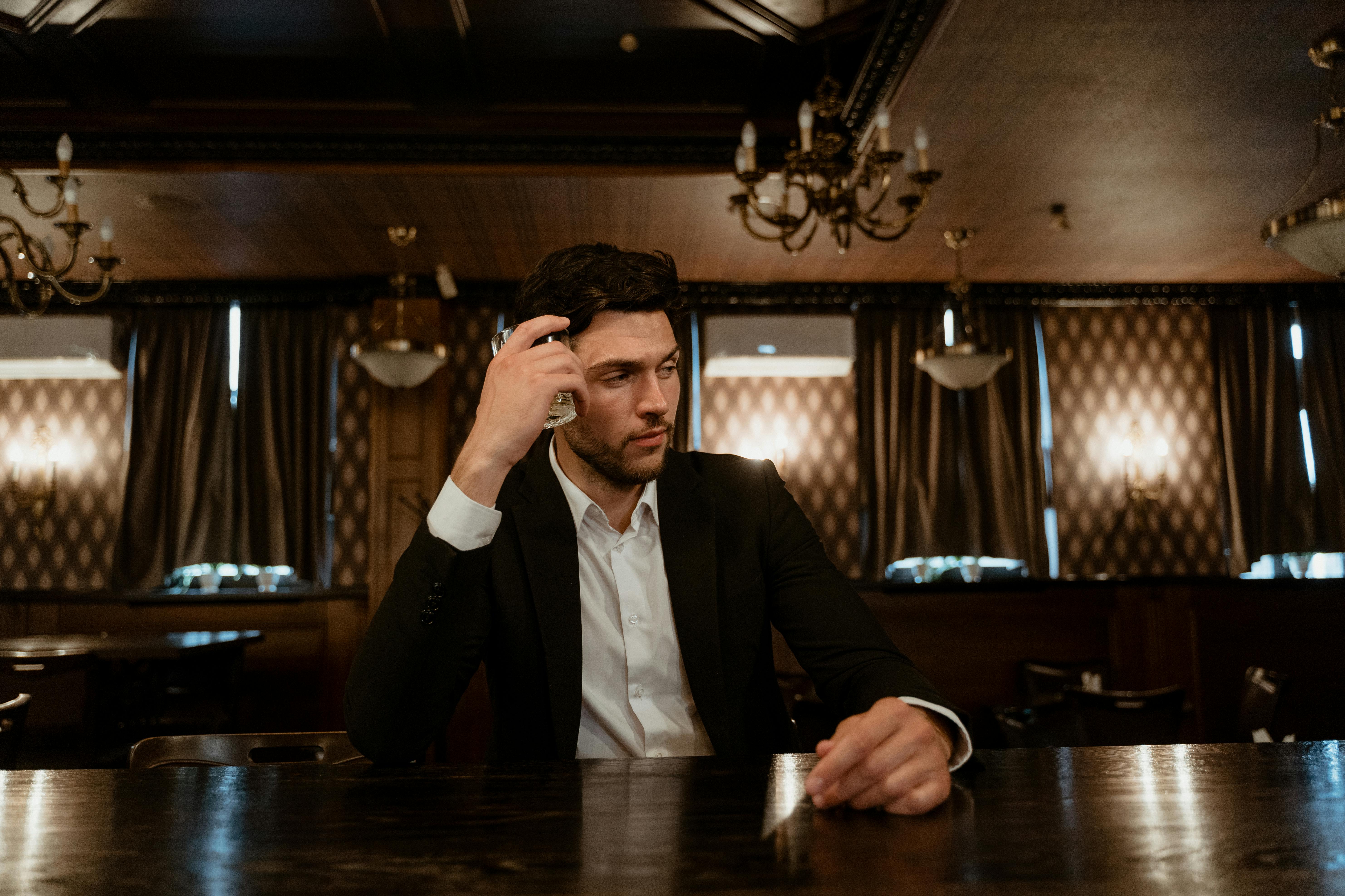 Man Wearing Black Suit in the Bar · Free Stock Photo