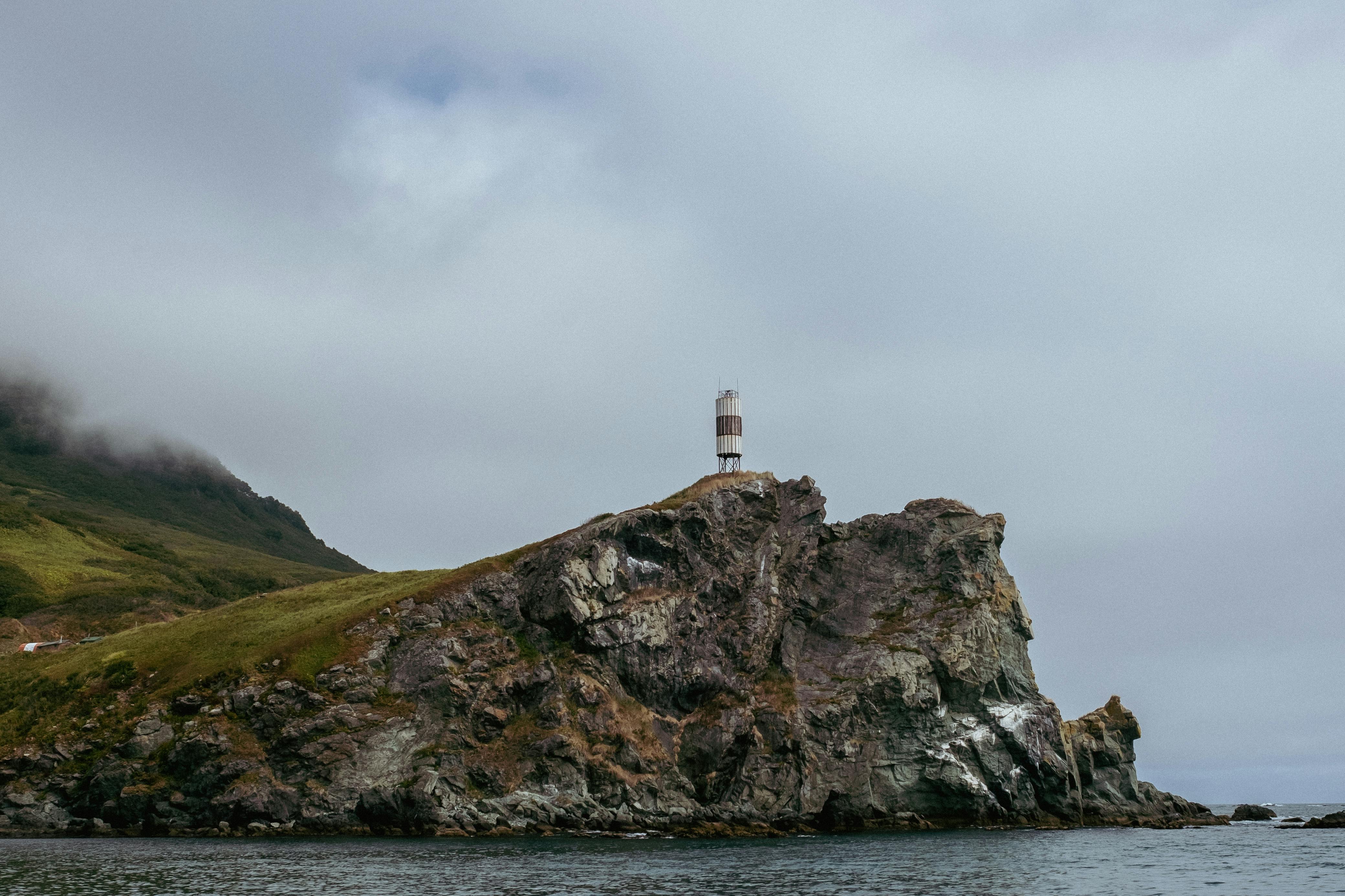 Lighthouse on Top of the Cliff · Free Stock Photo