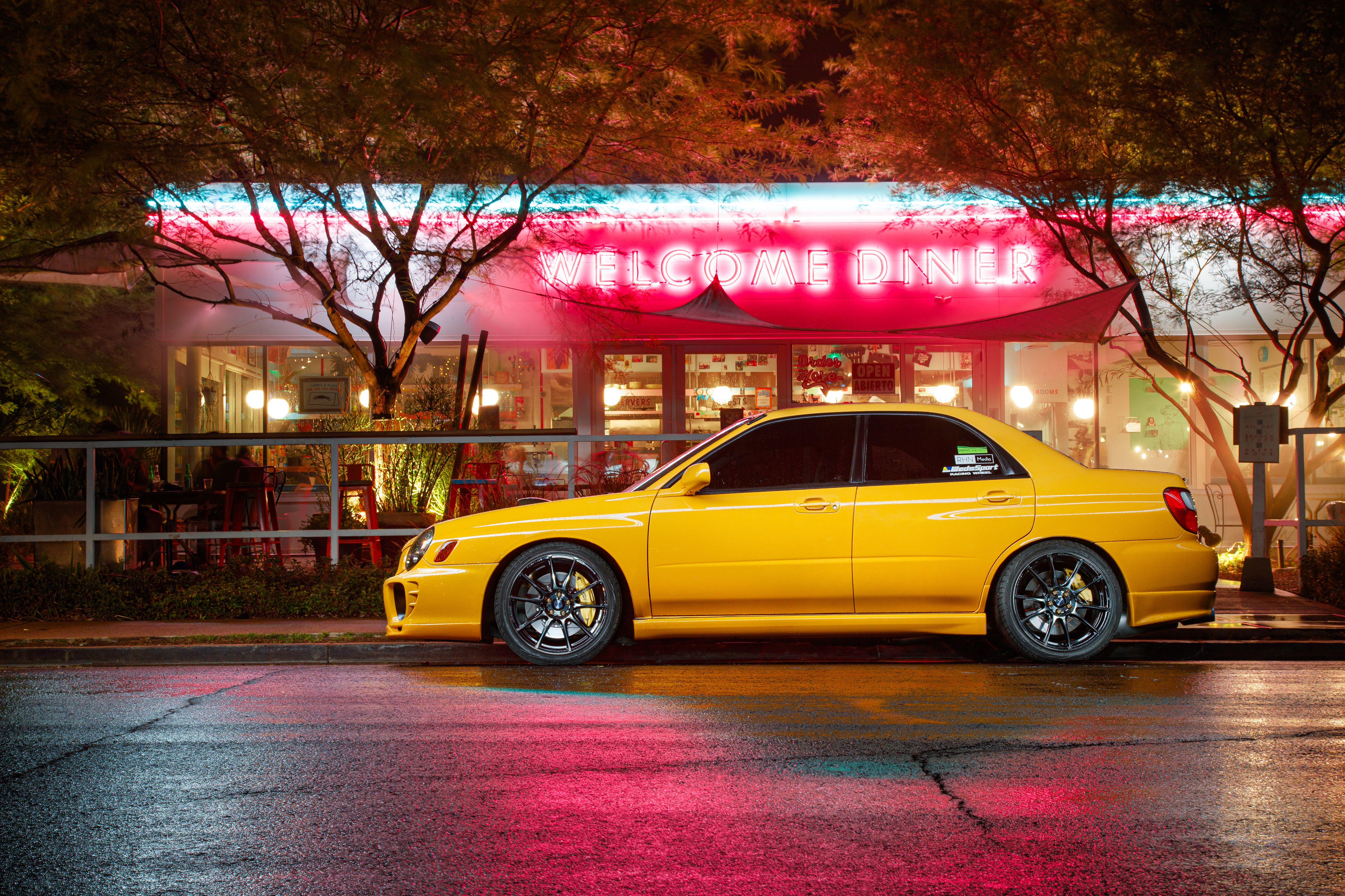 Yellow Sedan Parked on Side of the Road · Free Stock Photo