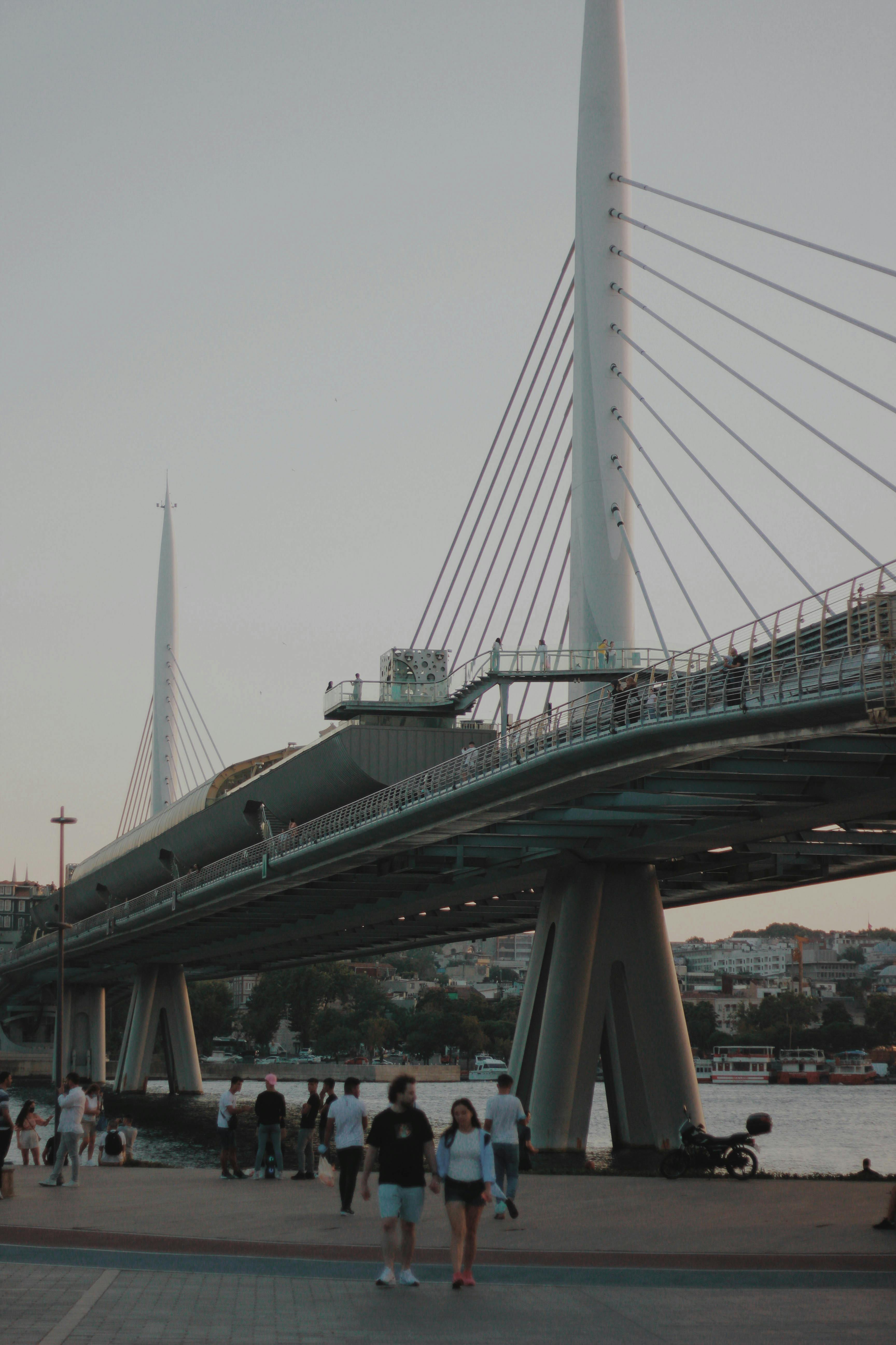 People Taking Photos and Walking by the Golden Horn Bridge at Night ...
