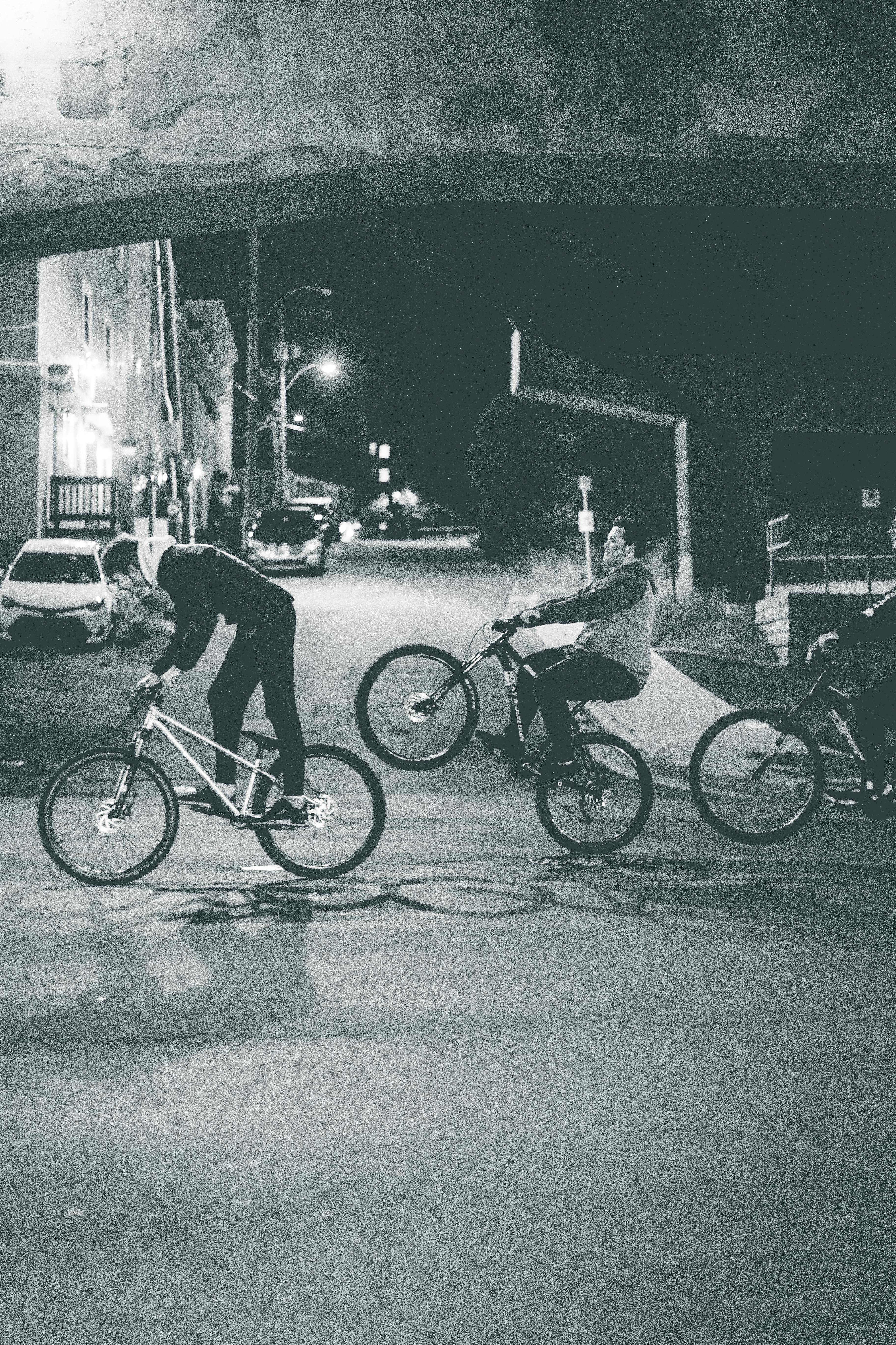 Grayscale Photography of Person Riding Bicycle · Free Stock Photo