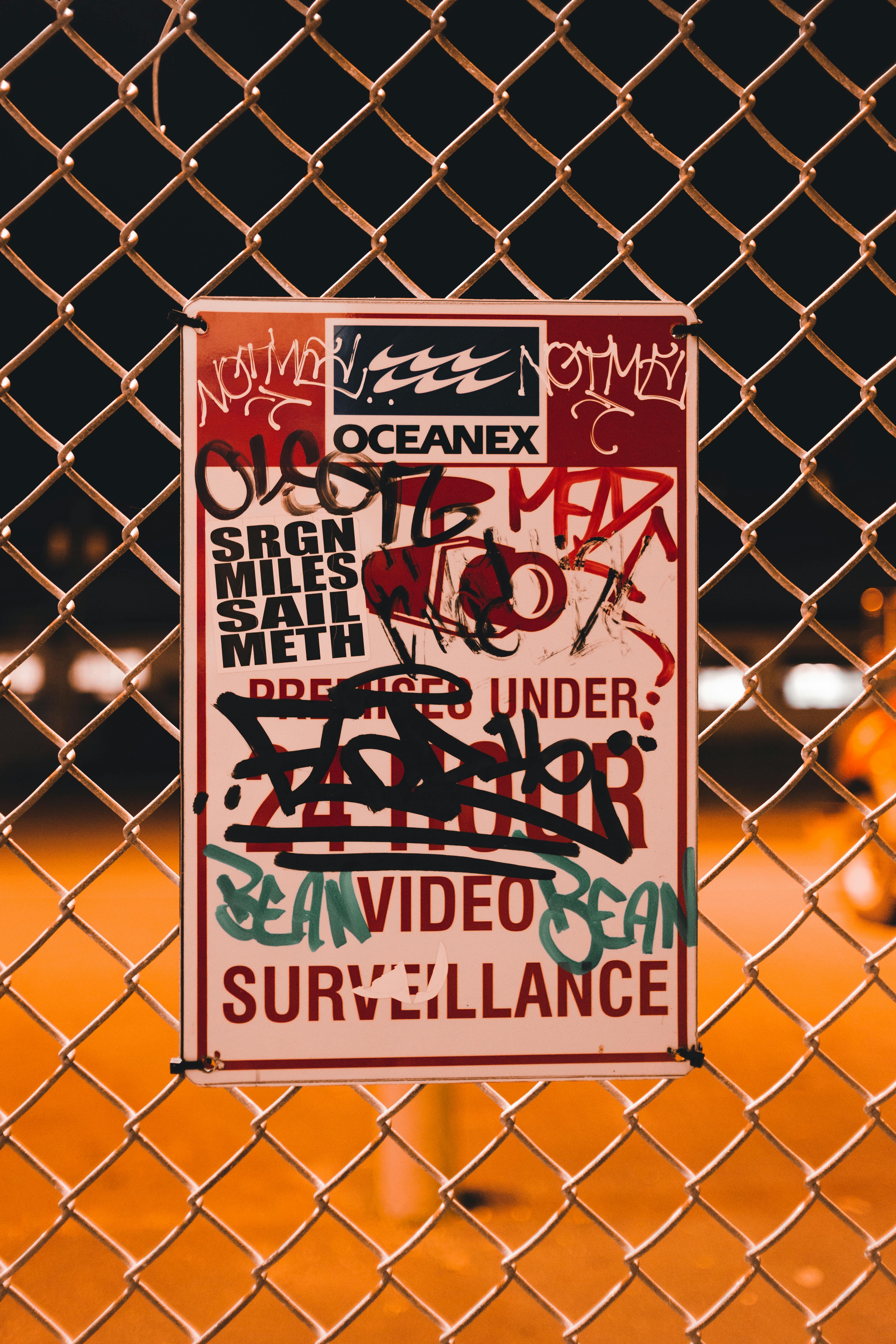 Text Signage on the Metal Fence · Free Stock Photo