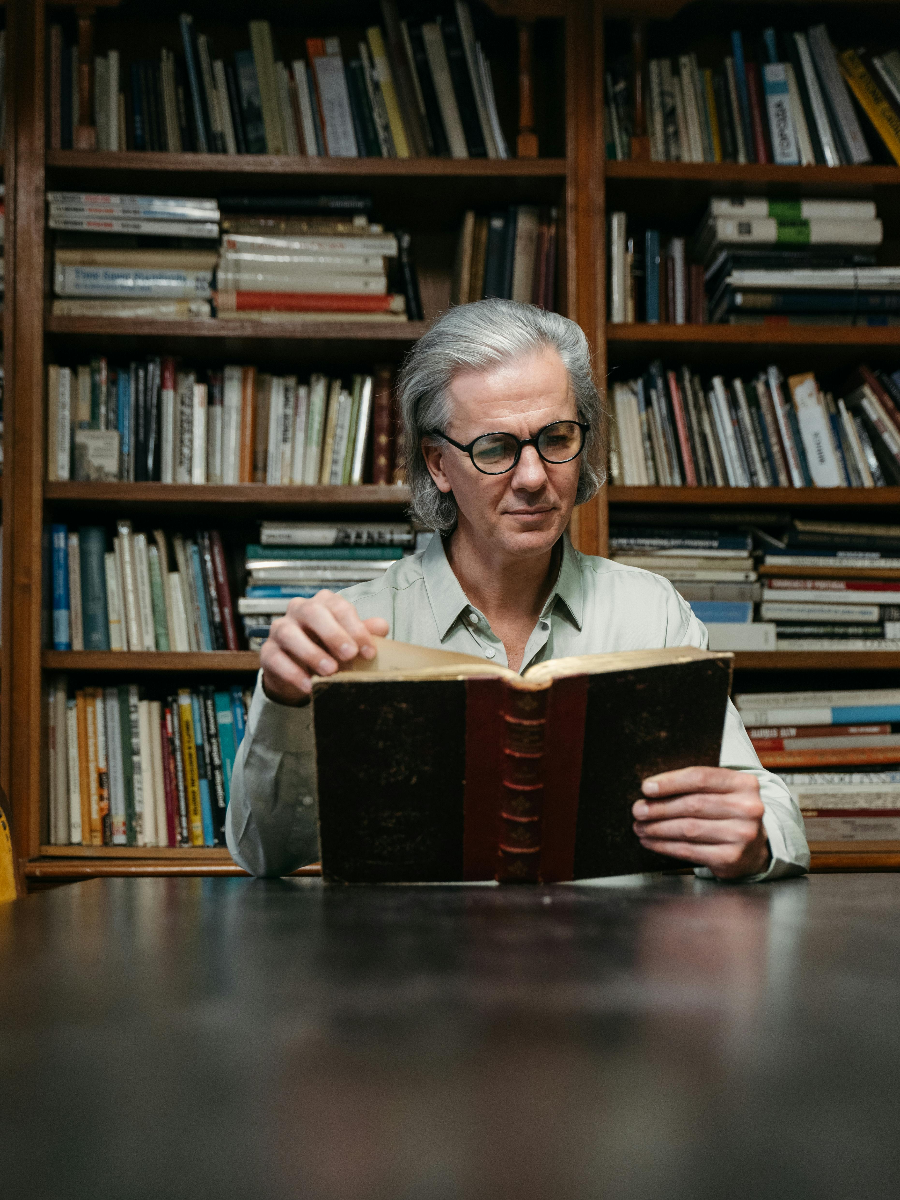 Man Reading a Book · Free Stock Photo
