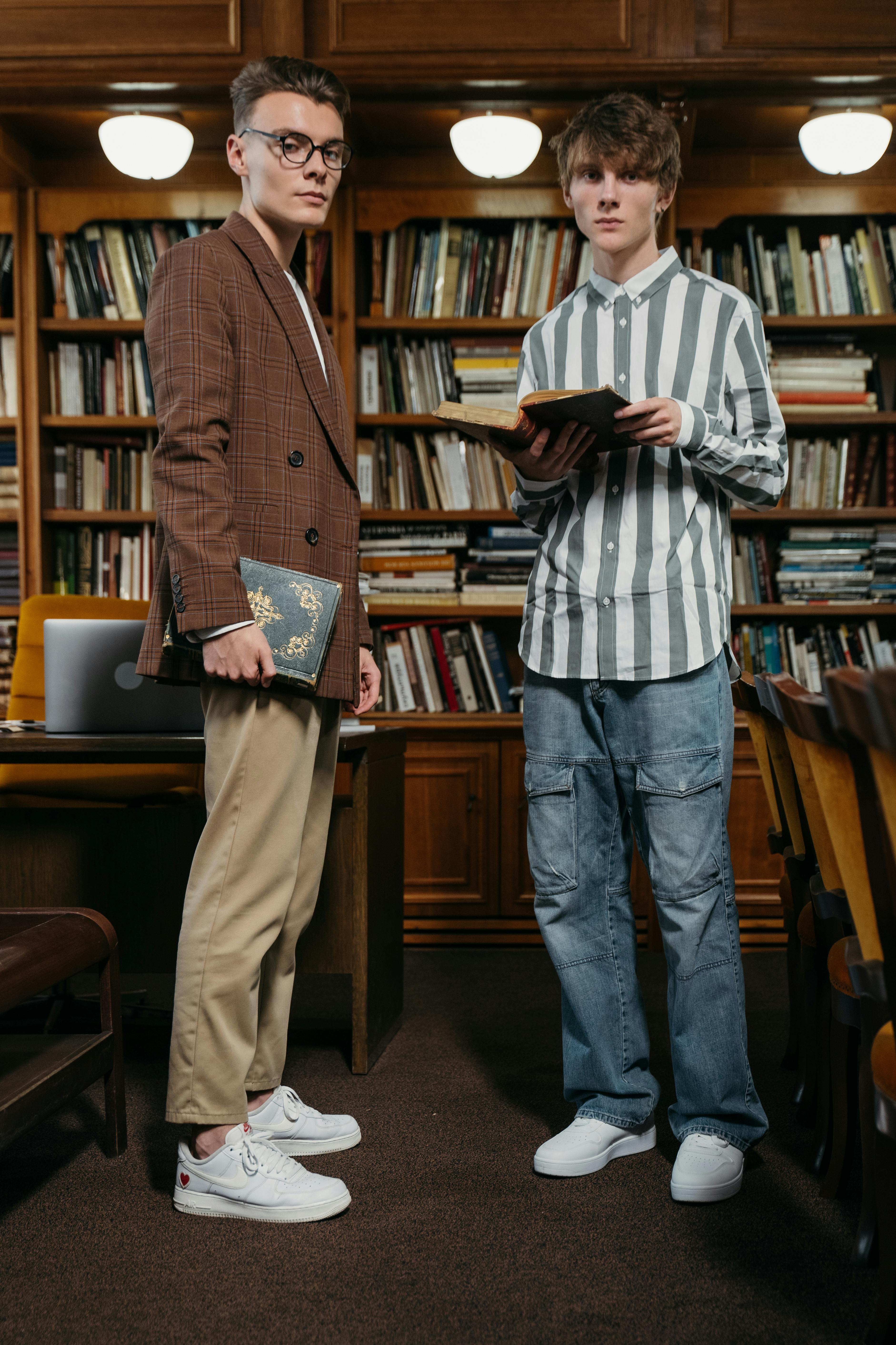 Men Holding Books in the Library · Free Stock Photo