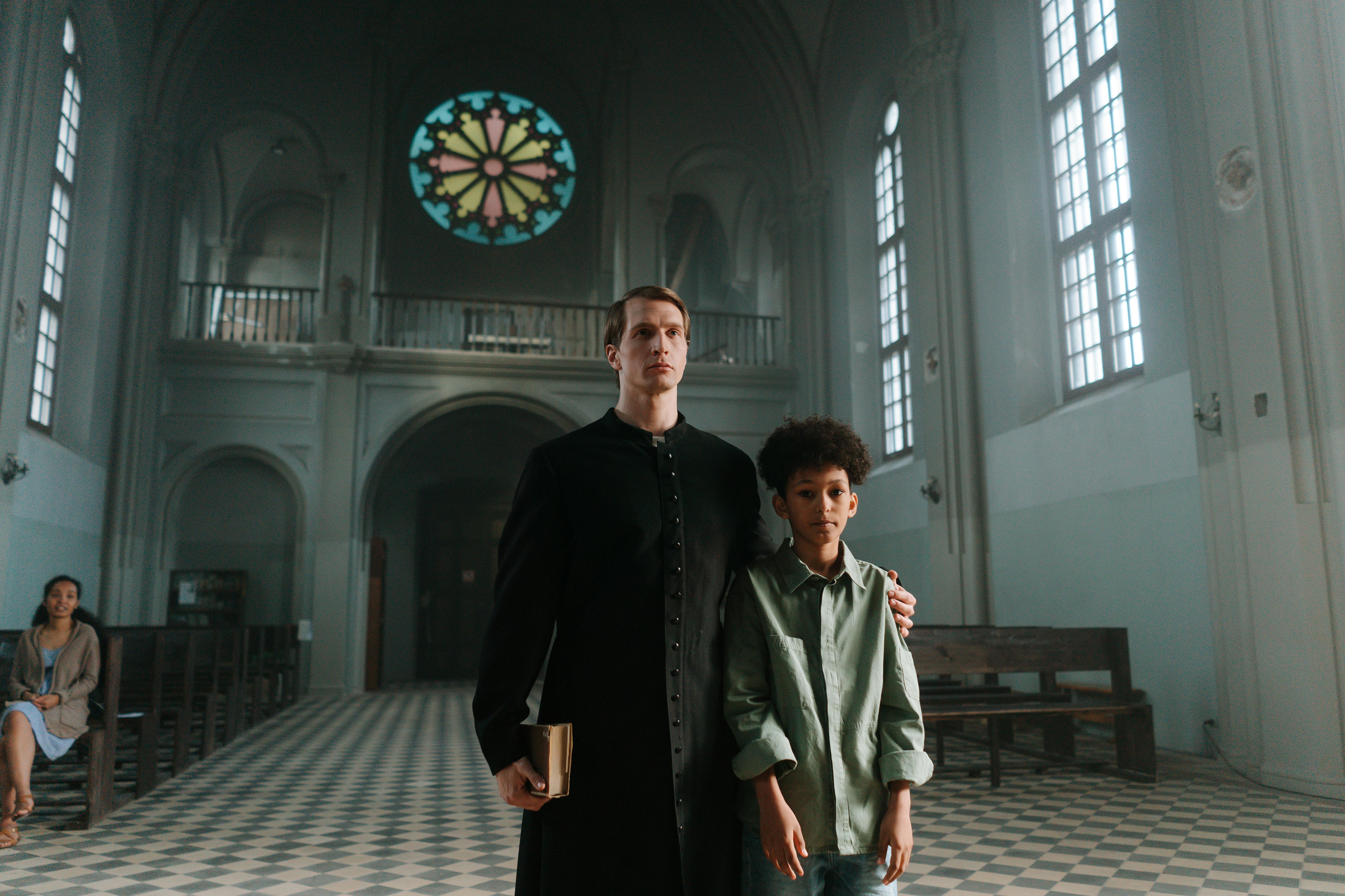 A Boy Standing Beside the Priest · Free Stock Photo