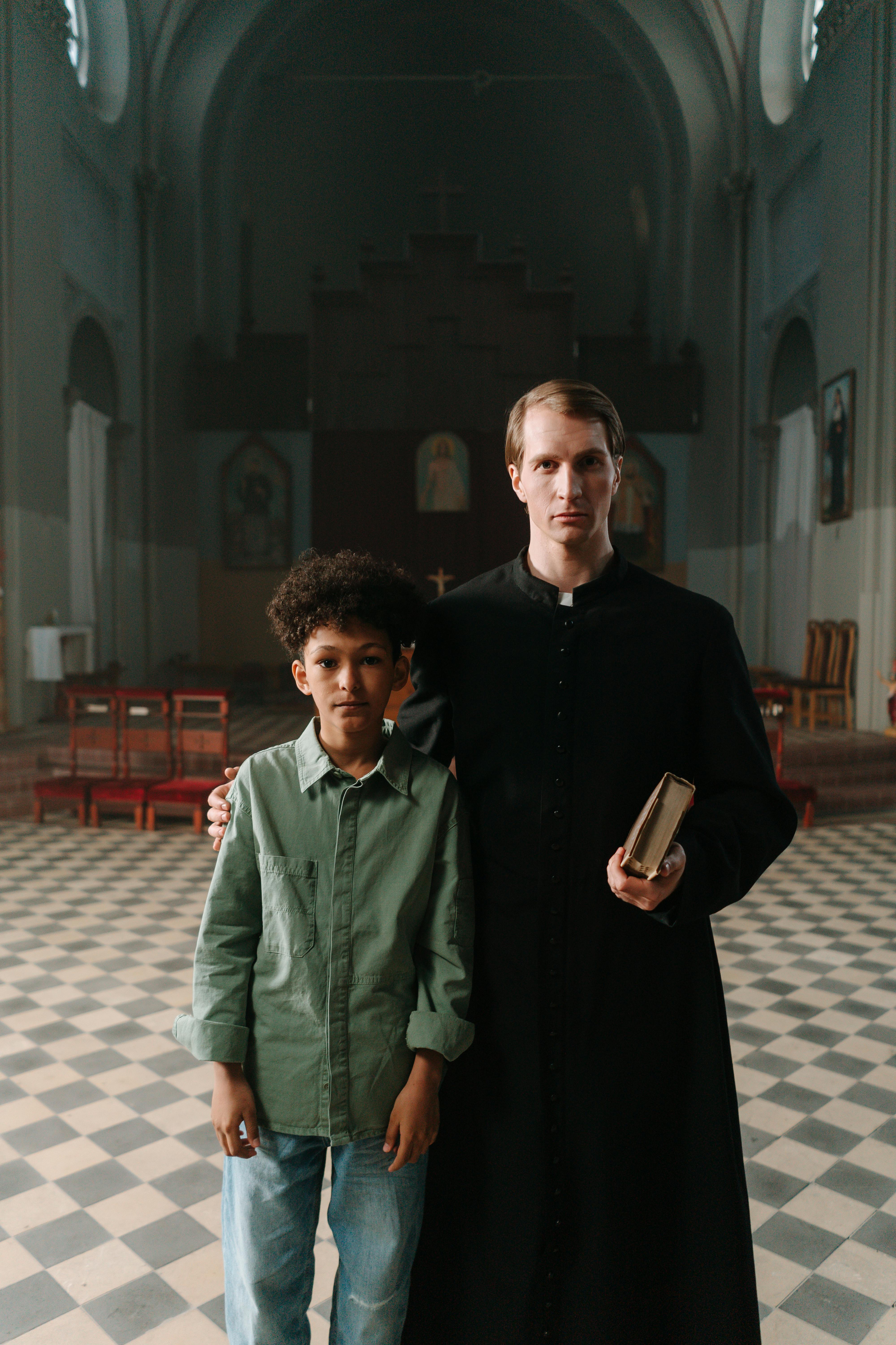 A Boy Standing Beside the Priest · Free Stock Photo