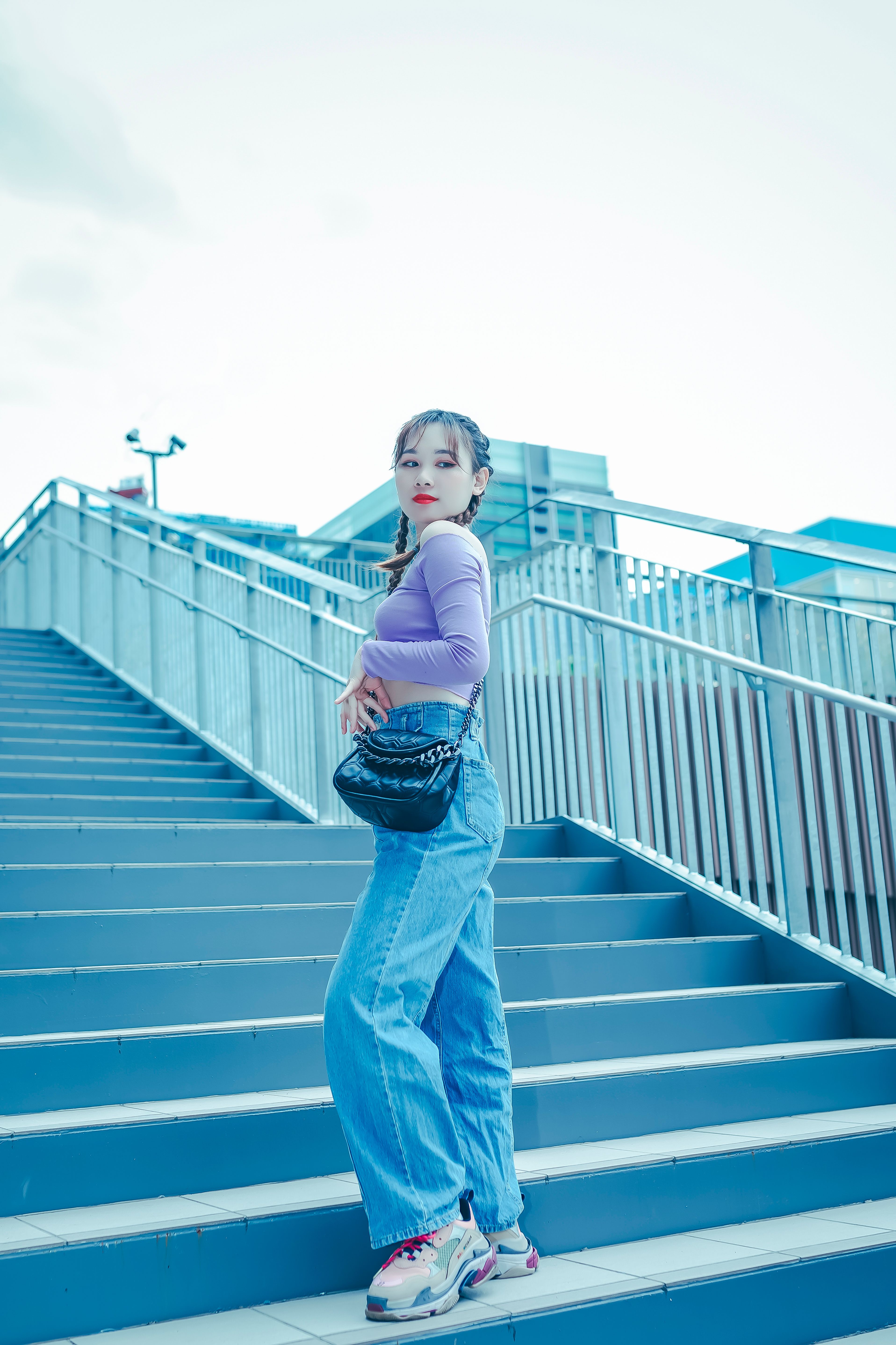 A Woman Standing on the Stairs · Free Stock Photo