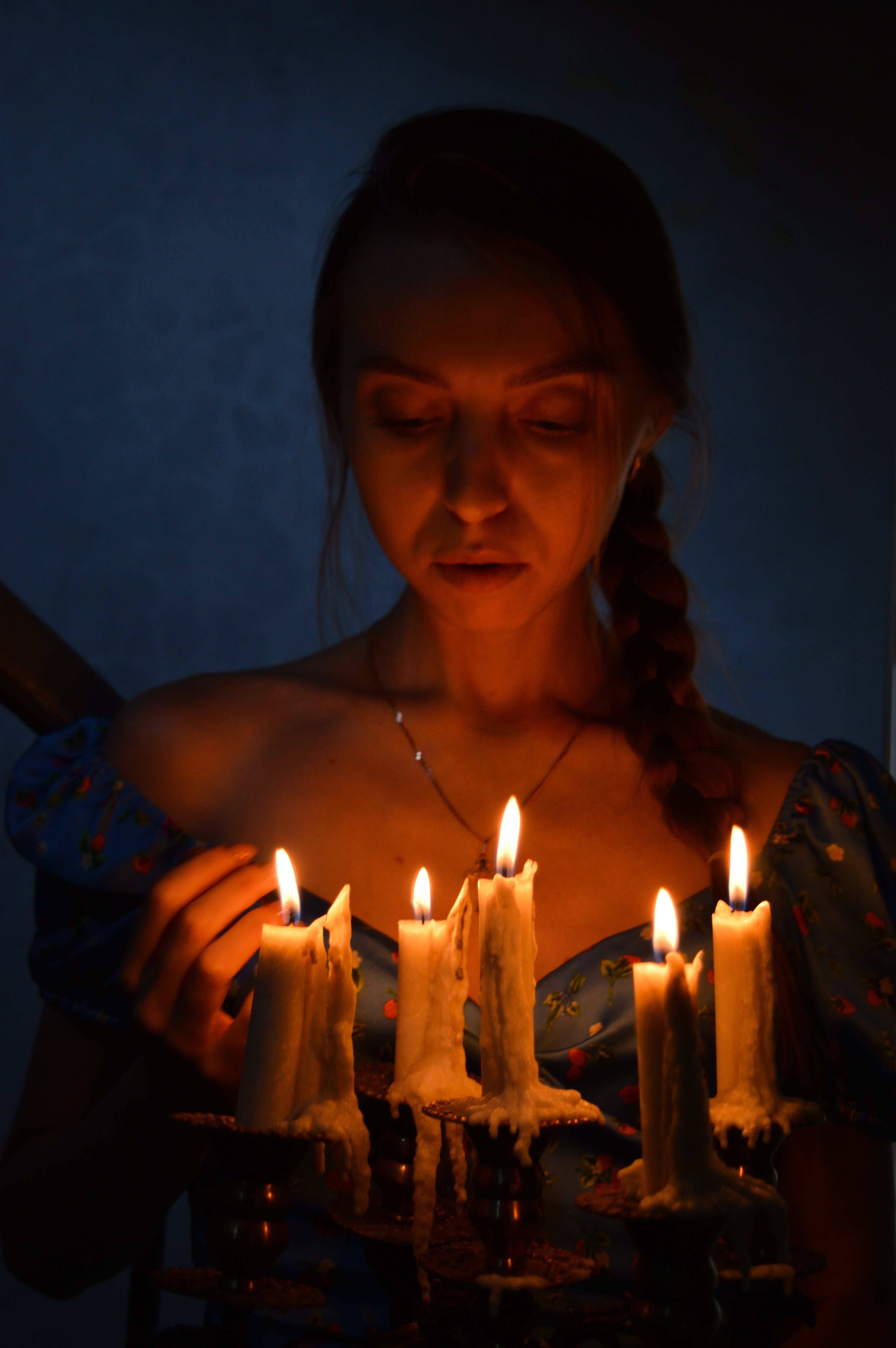 A Woman Standing Near the Lighted Candles · Free Stock Photo