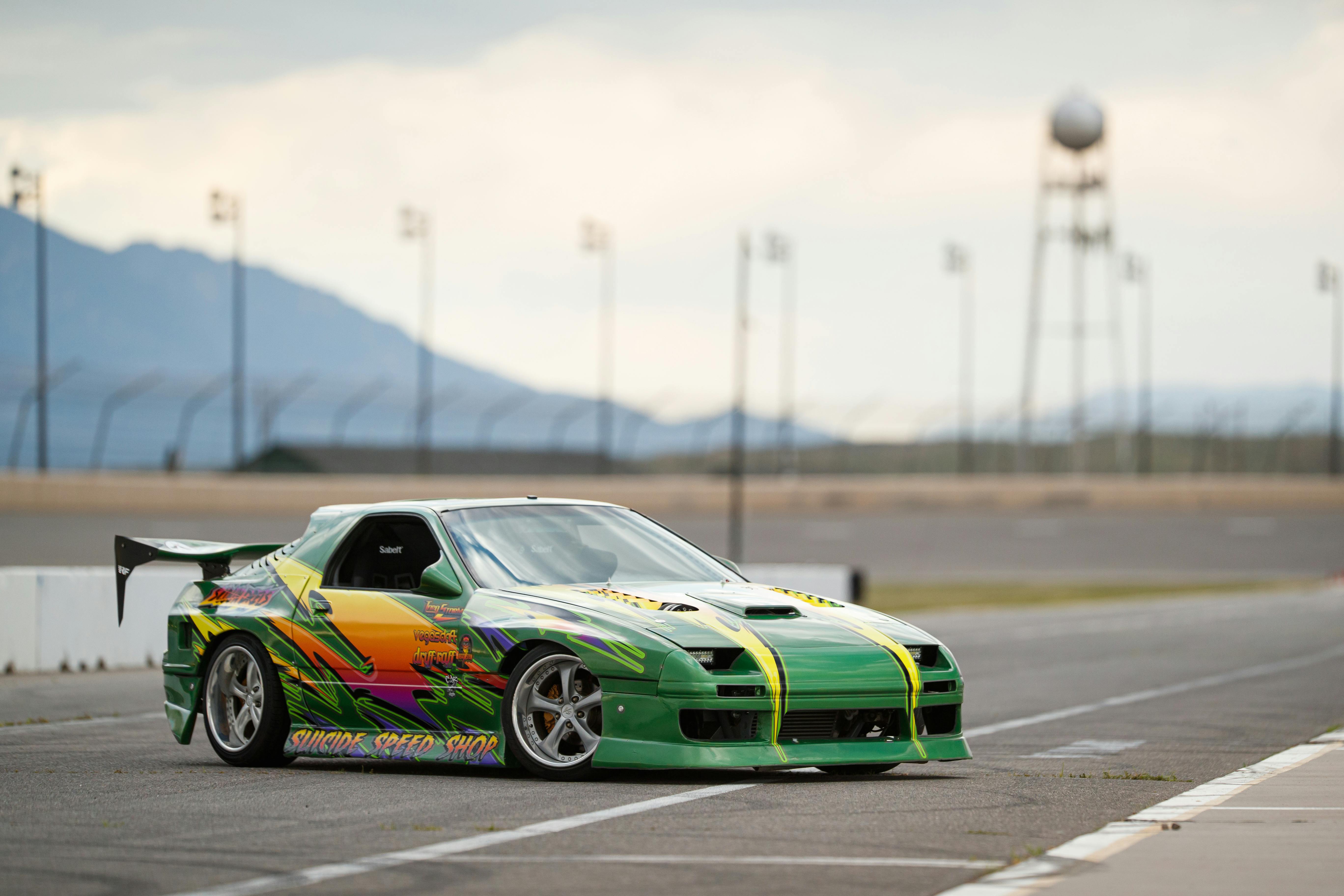 Green Mazda RX-7 Parked on the Road · Free Stock Photo