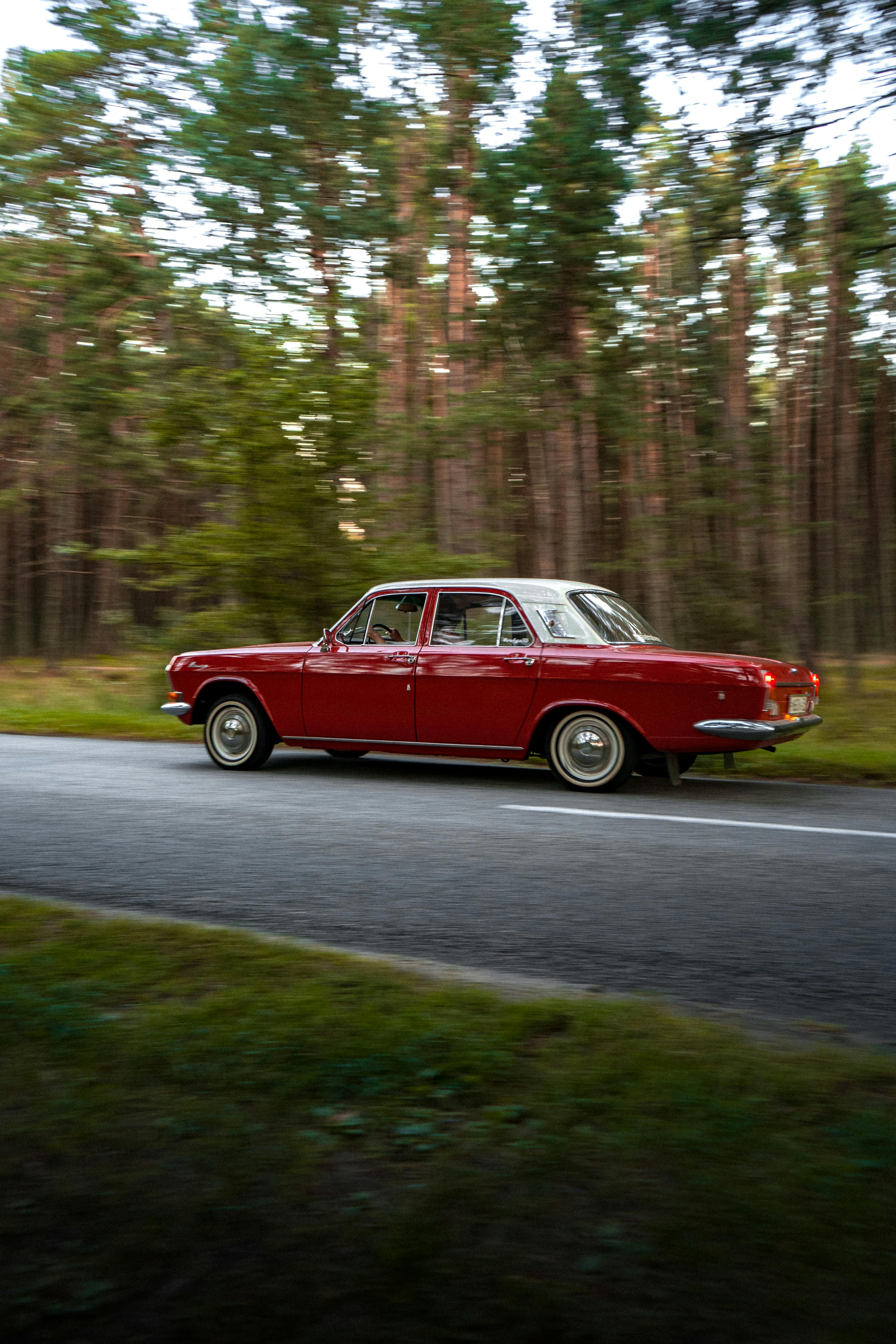 A Red Car on the Road · Free Stock Photo