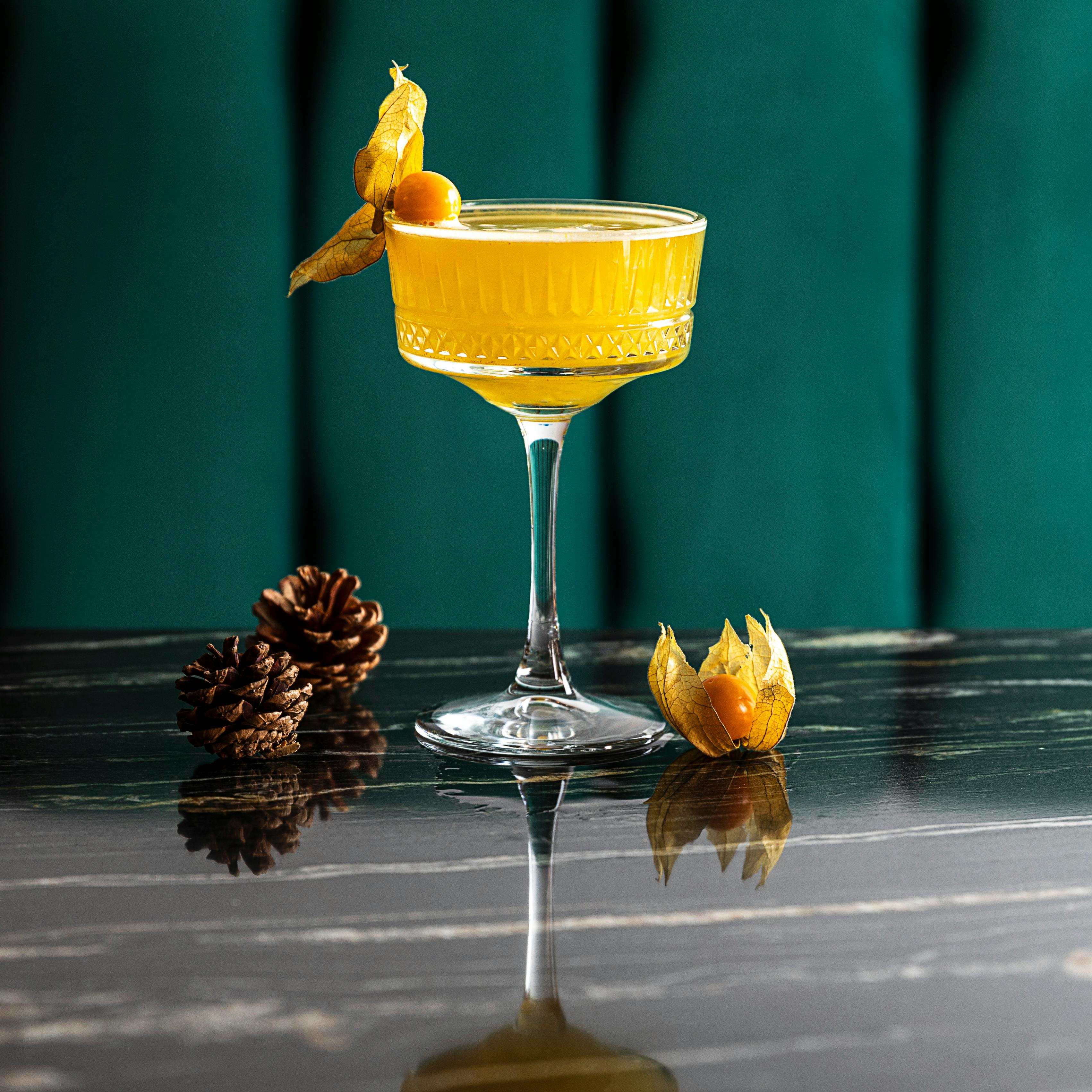 Yellow Liquid in Clear Cocktail Glass · Free Stock Photo