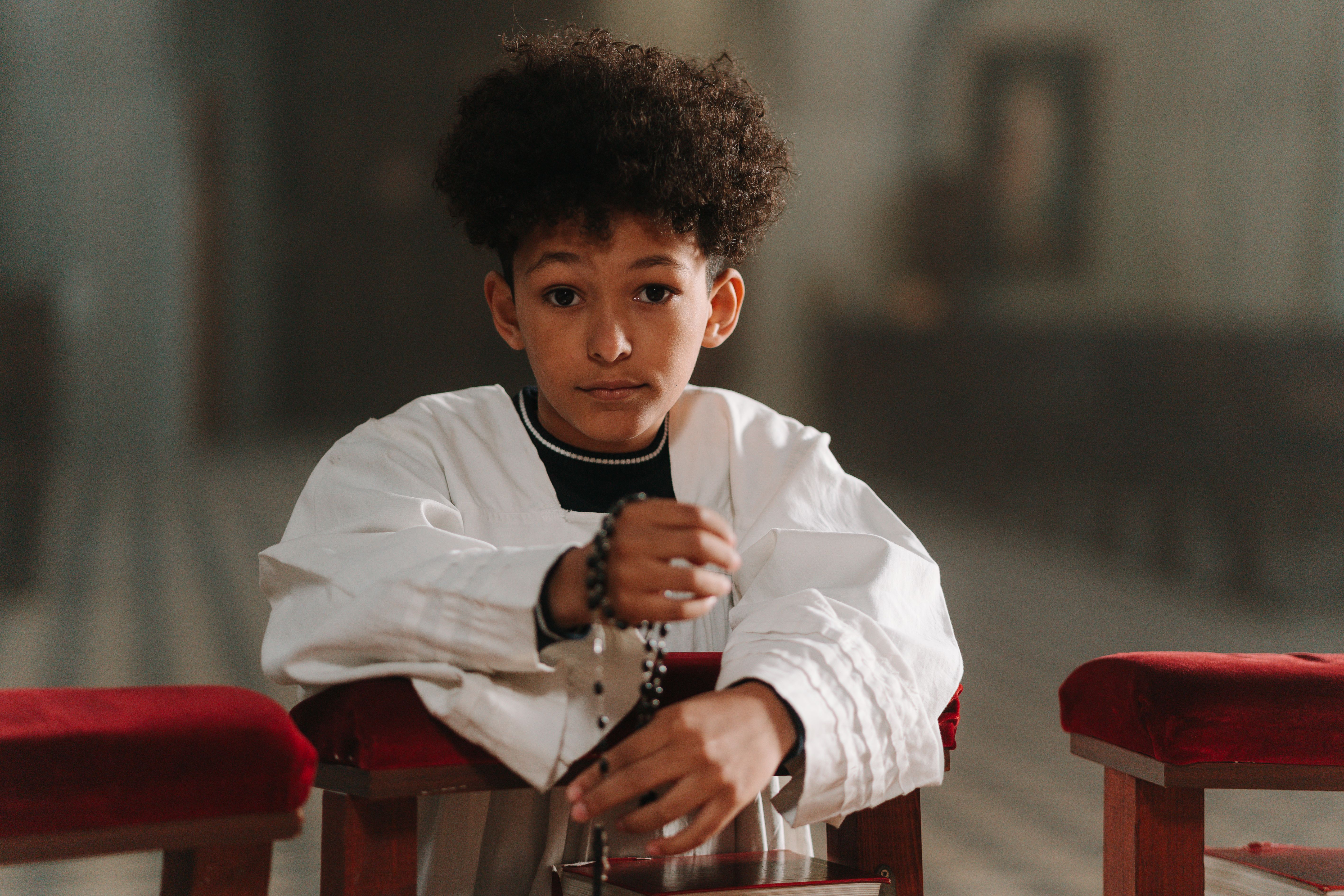 A Close-Up Shot of a Boy Praying · Free Stock Photo
