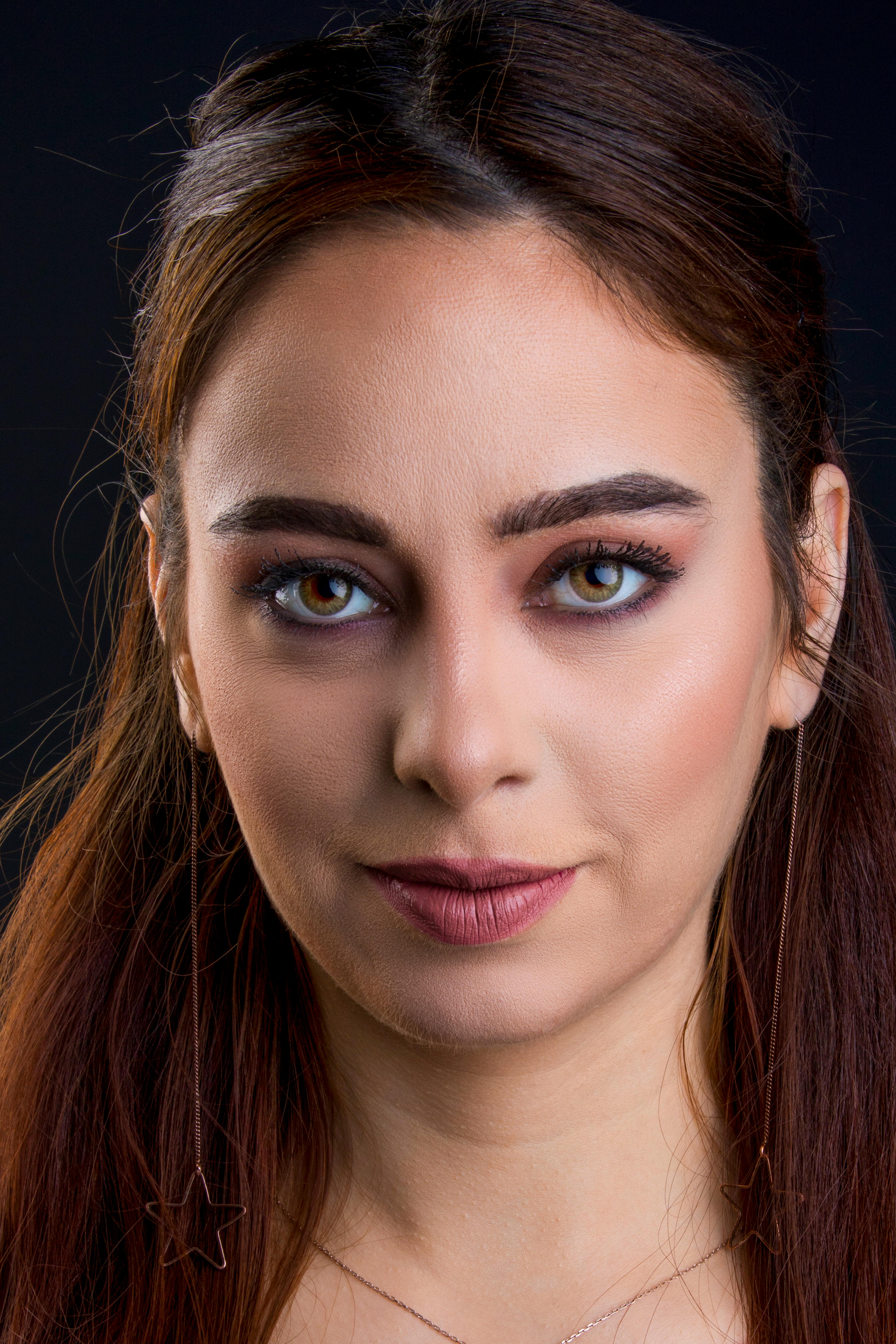 Woman with stylish makeup in sunbeams · Free Stock Photo