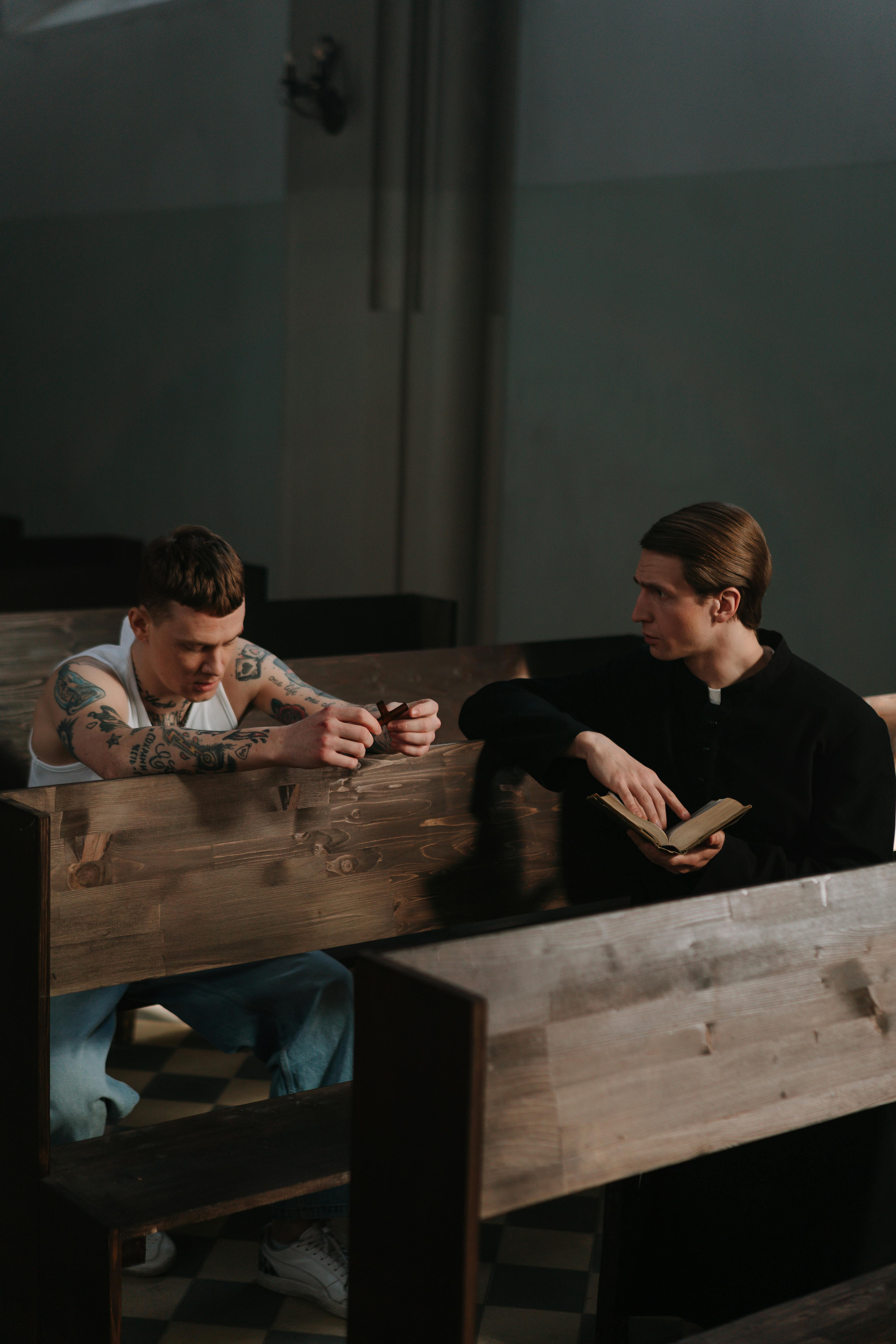 A Priest Talking to the Man Inside the Church · Free Stock Photo